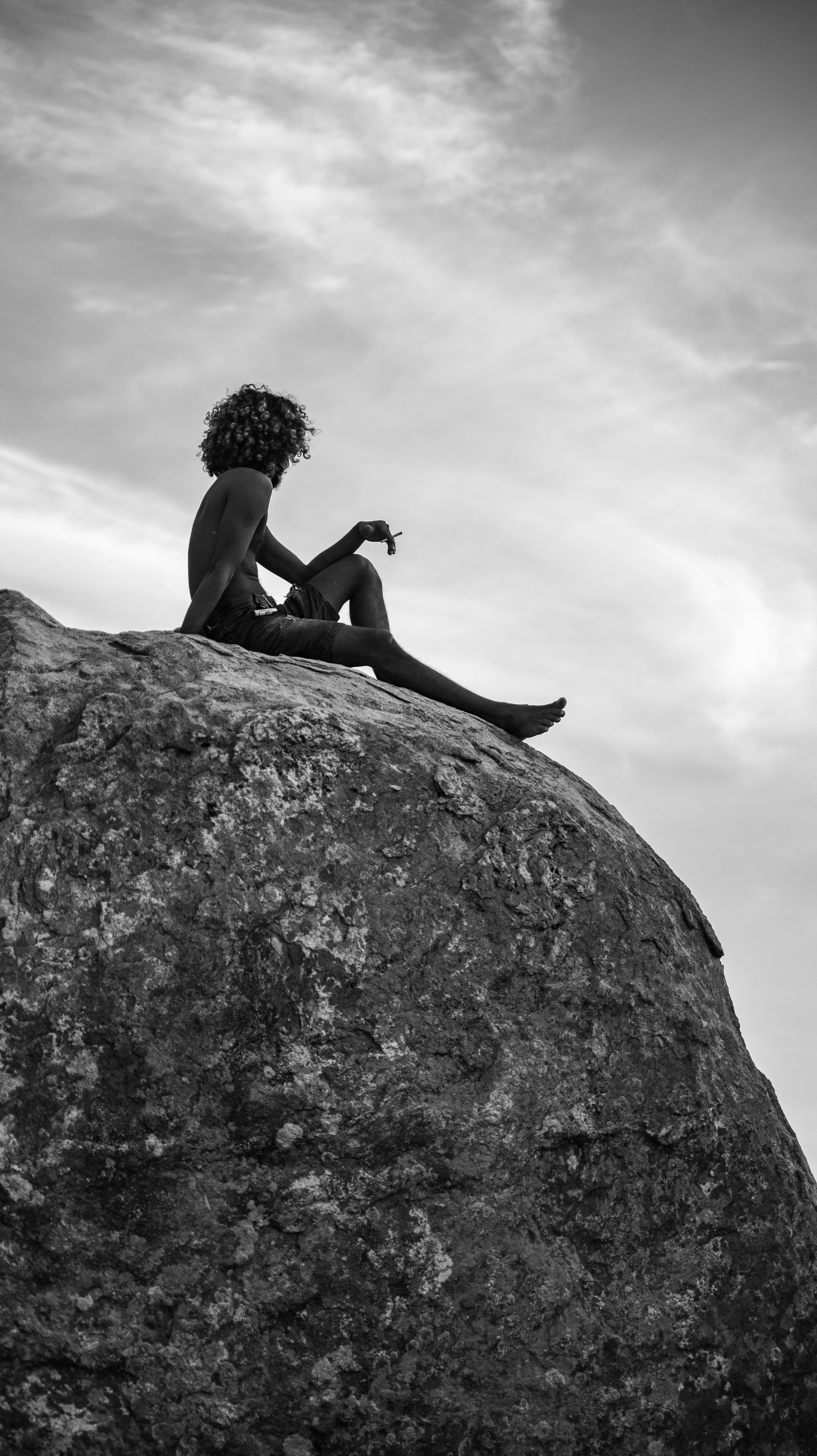 Women Sitting on a Big Rock · Free Stock Photo