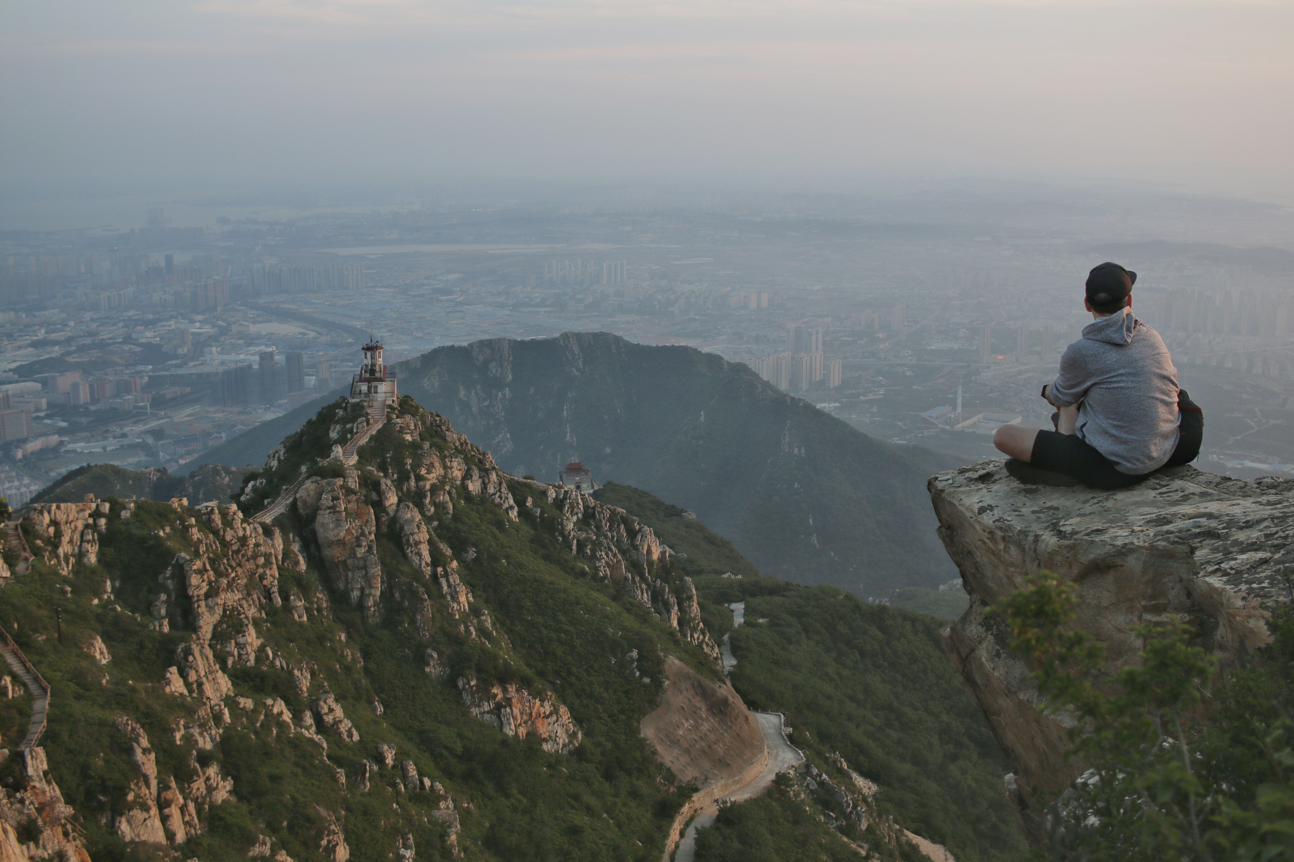 Person Sitting on a Cliff · Free Stock Photo