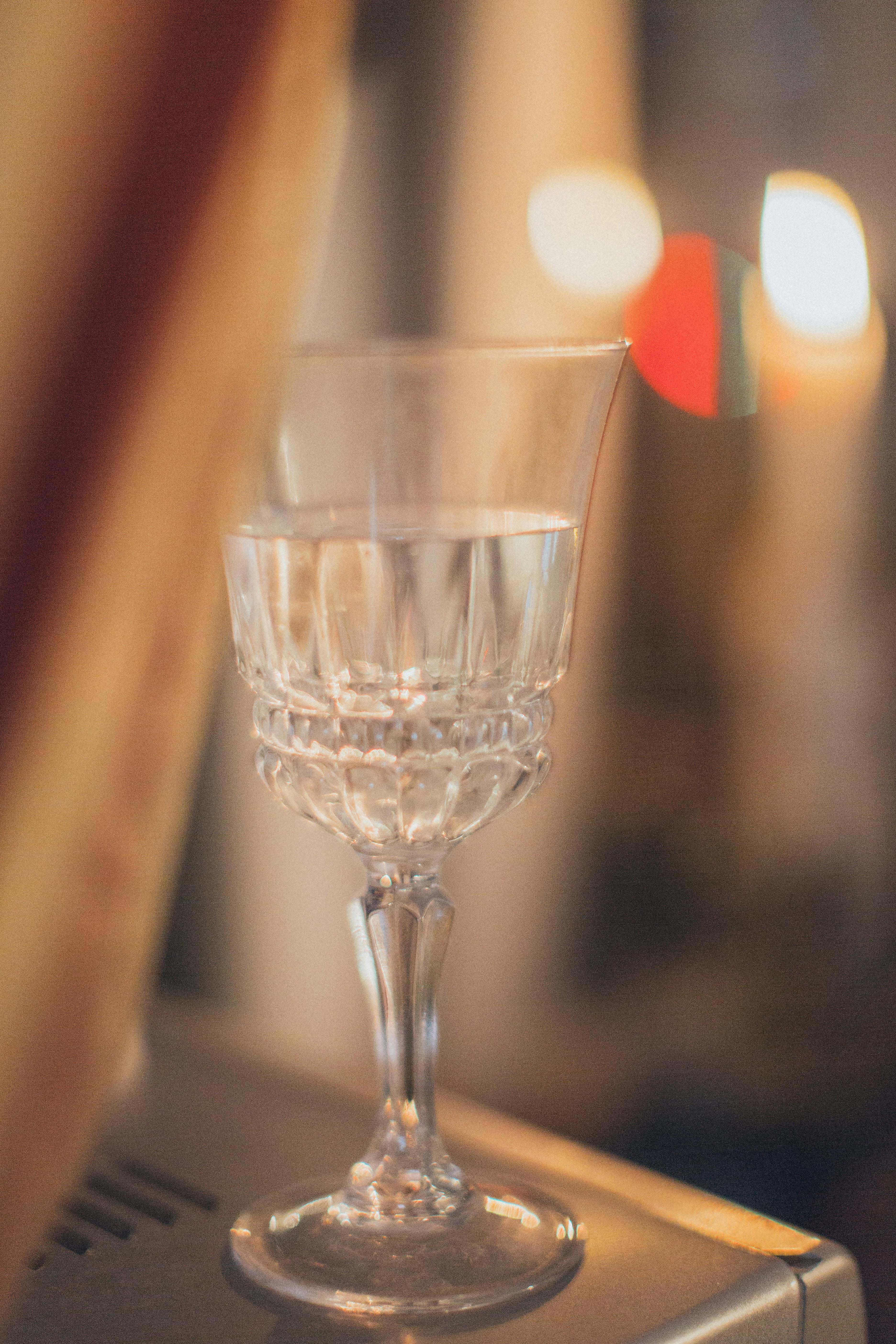 Glass of water in room in evening · Free Stock Photo