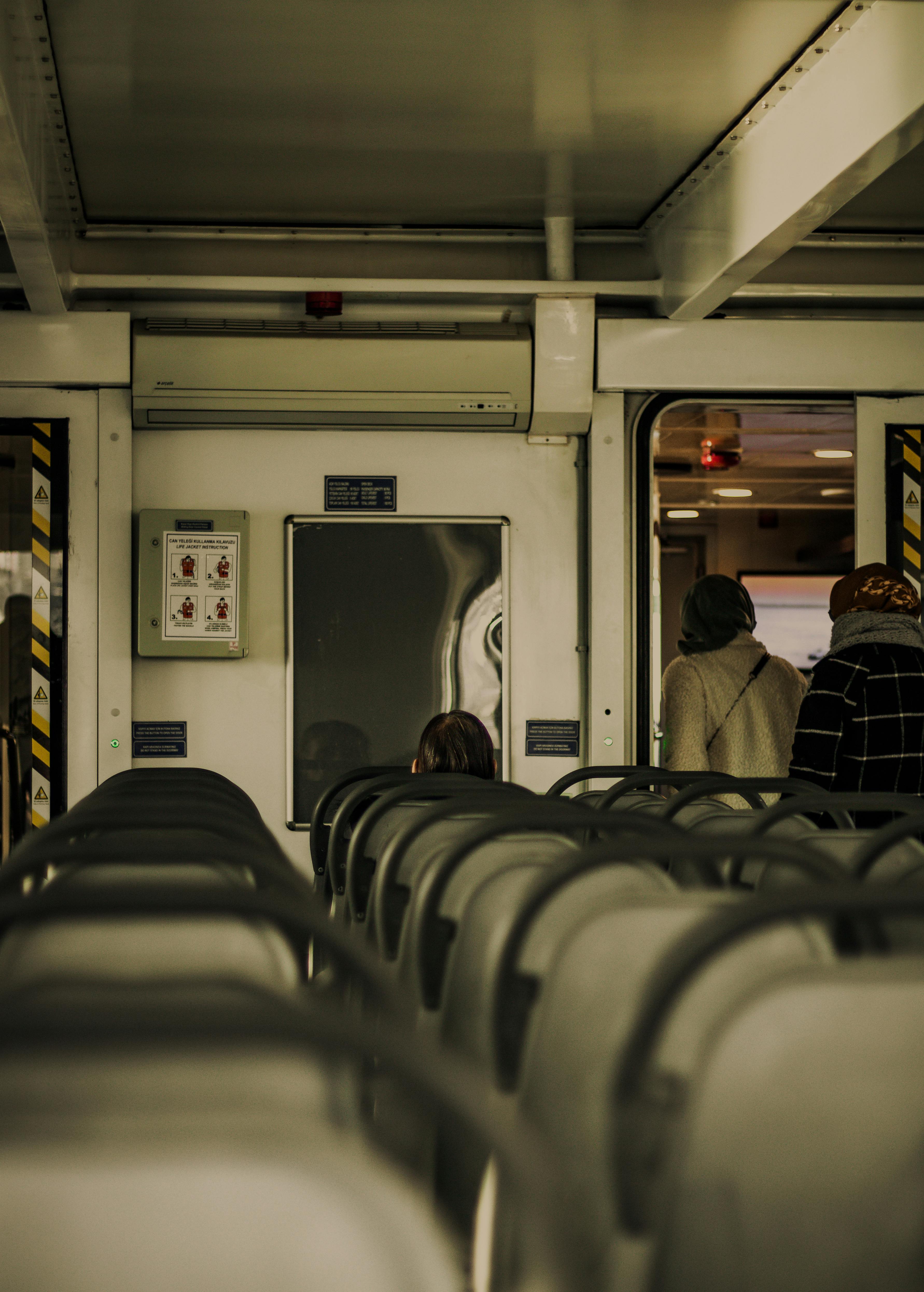 Back View of a Man Sitting in a Train · Free Stock Photo