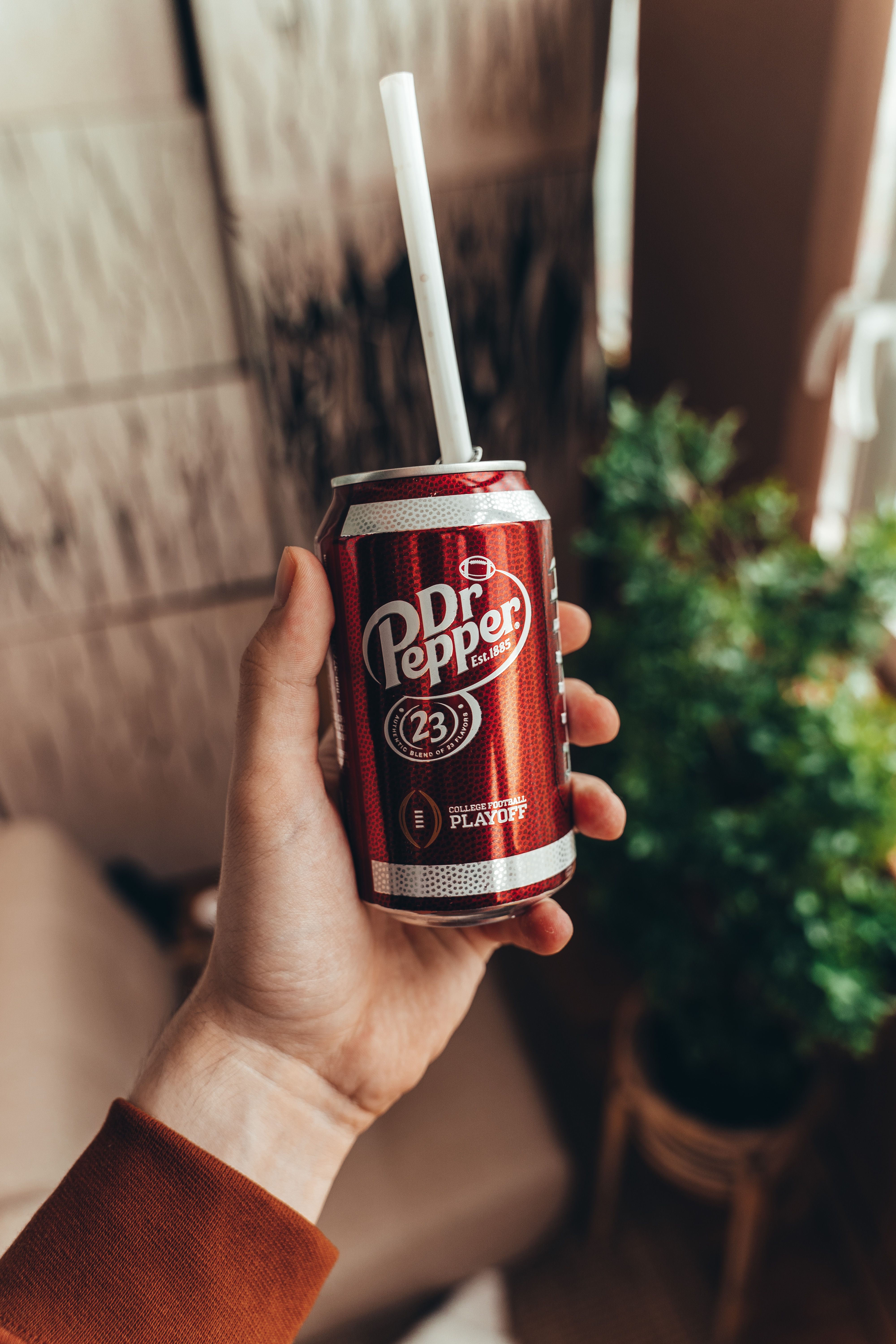 Anonymous person with soda can in hand · Free Stock Photo