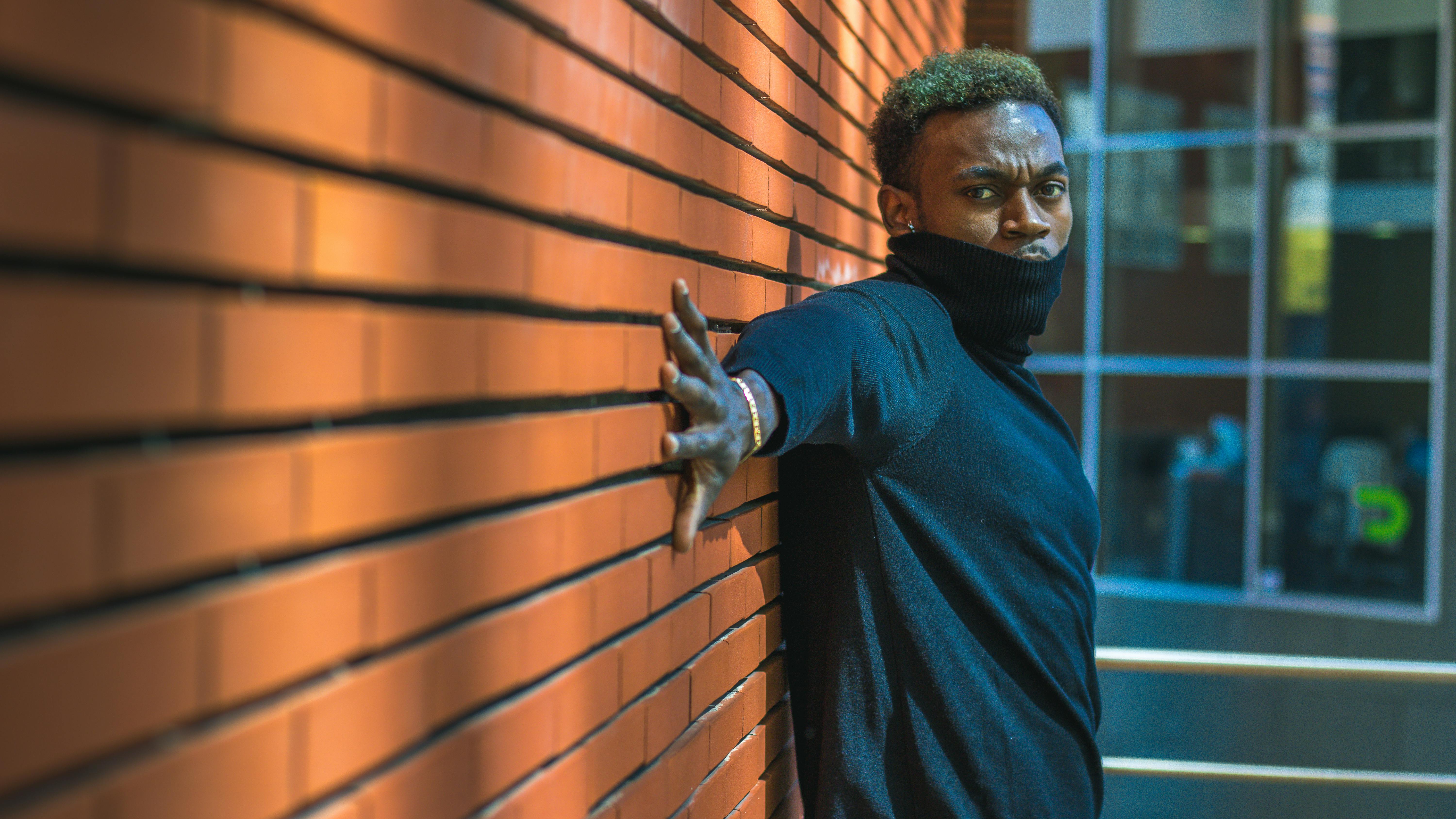 Photo Of Man Behind A Wall · Free Stock Photo