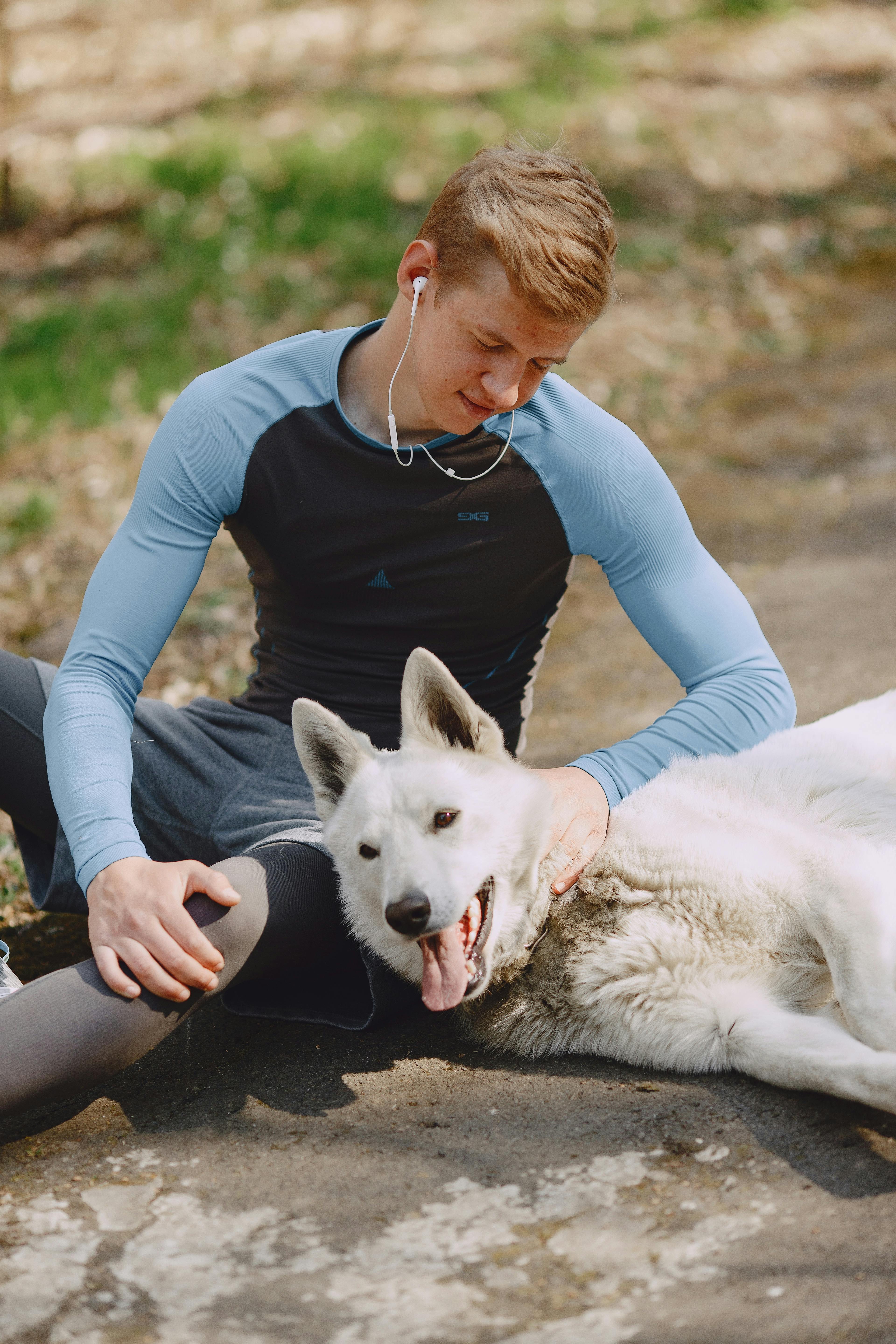 Photo of Man Petting His Dog · Free Stock Photo