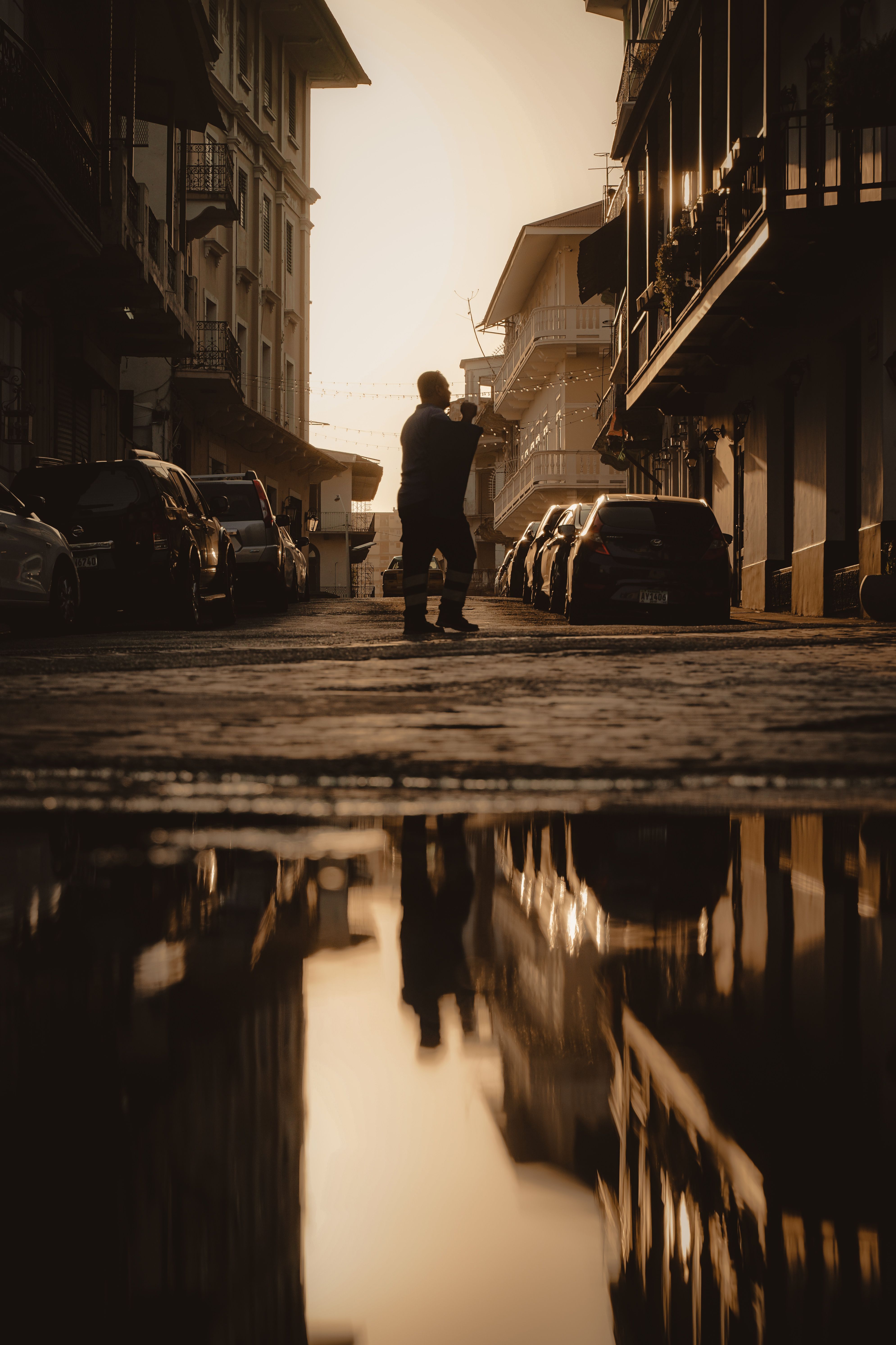 Low Angle Shot of Man Walking on Street · Free Stock Photo
