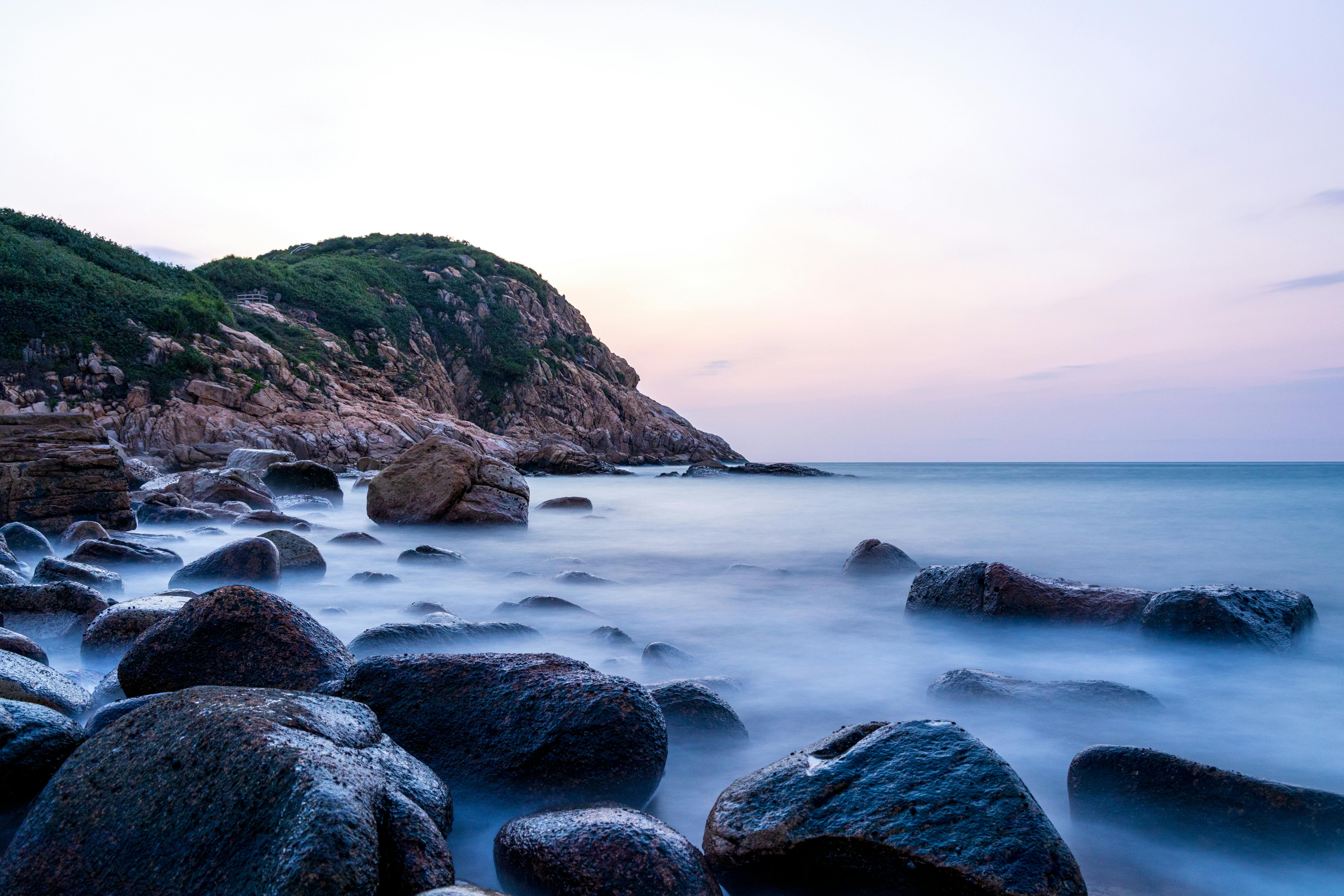Rocky Shore near the Rock Mountain · Free Stock Photo