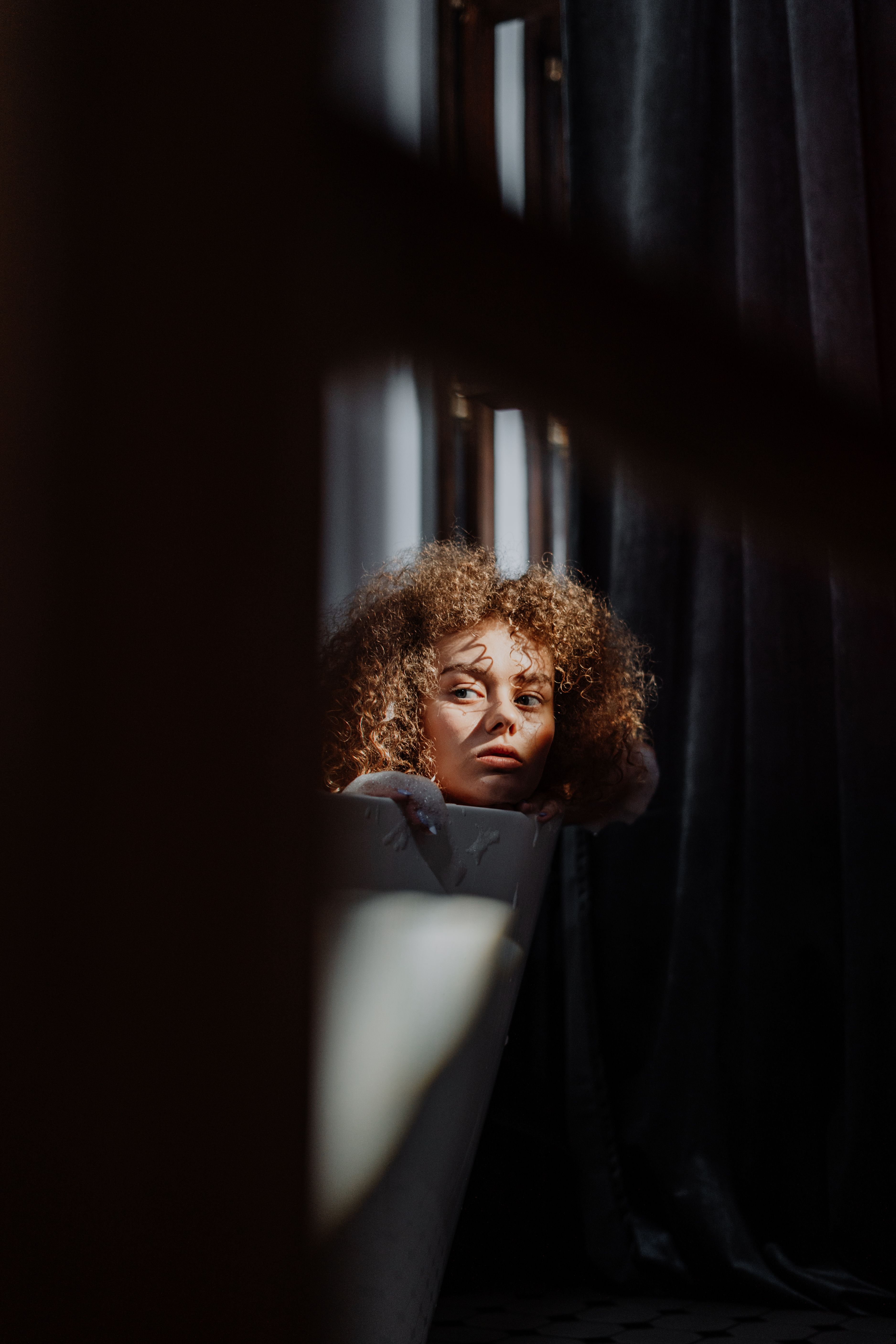 Man in Black Coat Standing Near Window · Free Stock Photo
