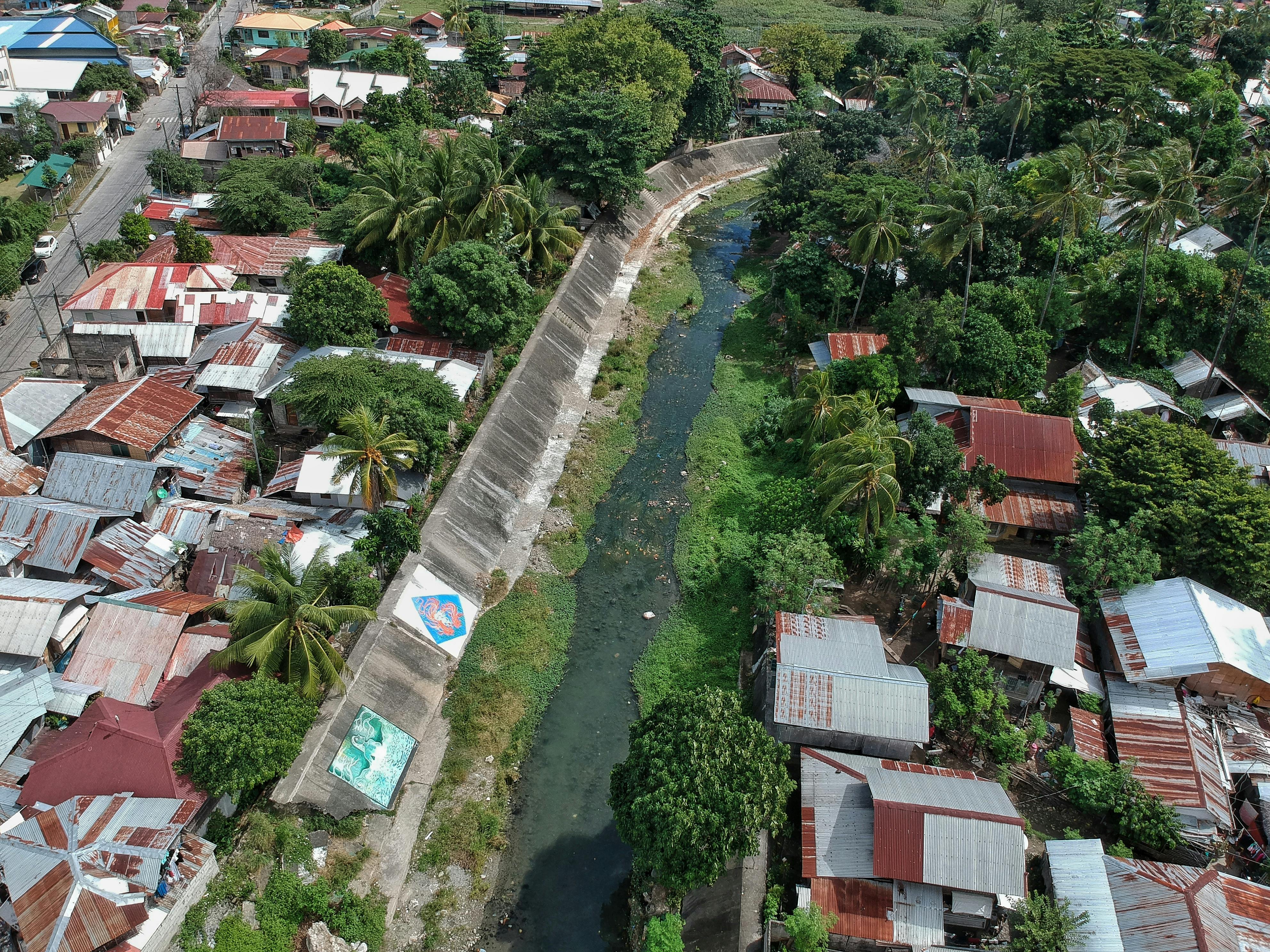 Old village on river bank in sunny day · Free Stock Photo