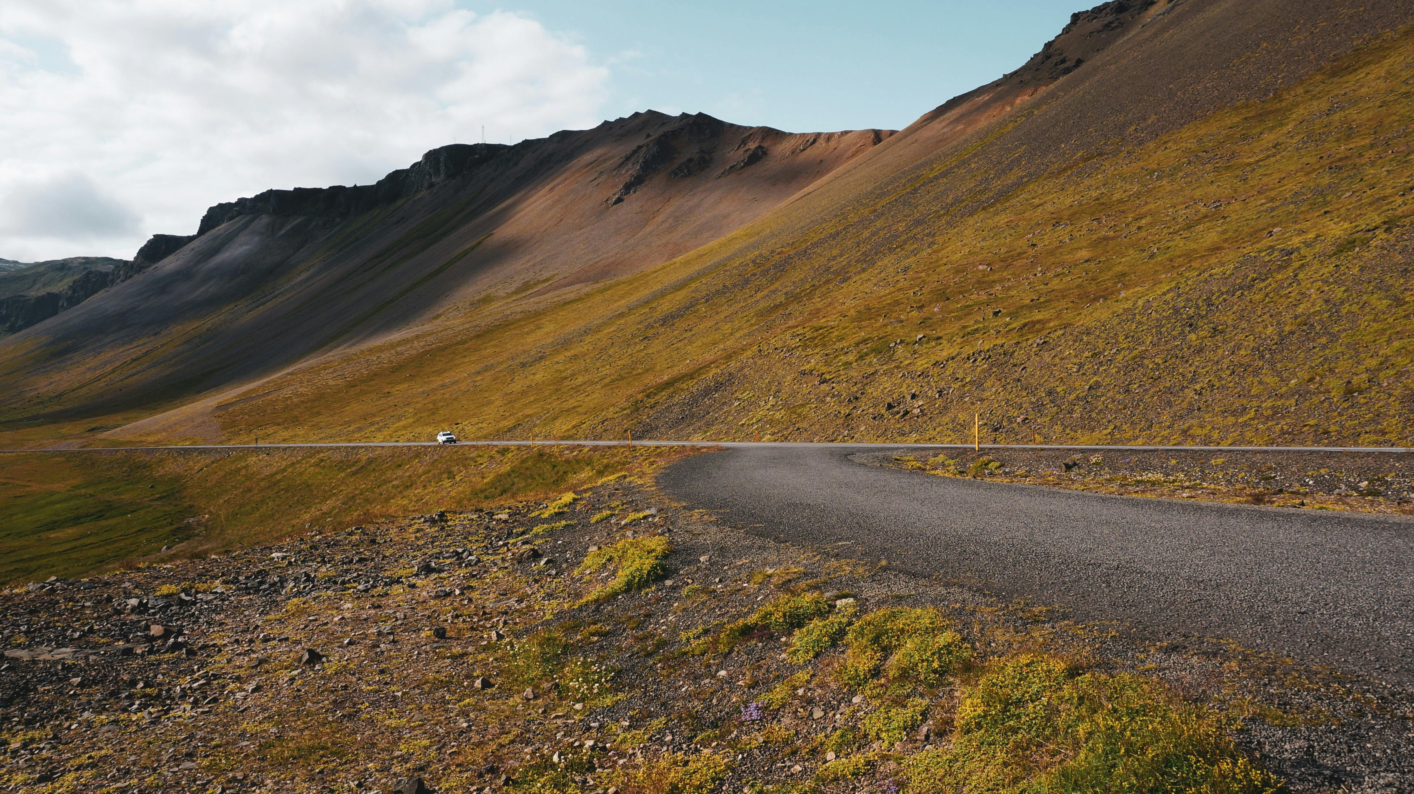 A Car on the Mountainside Road · Free Stock Photo
