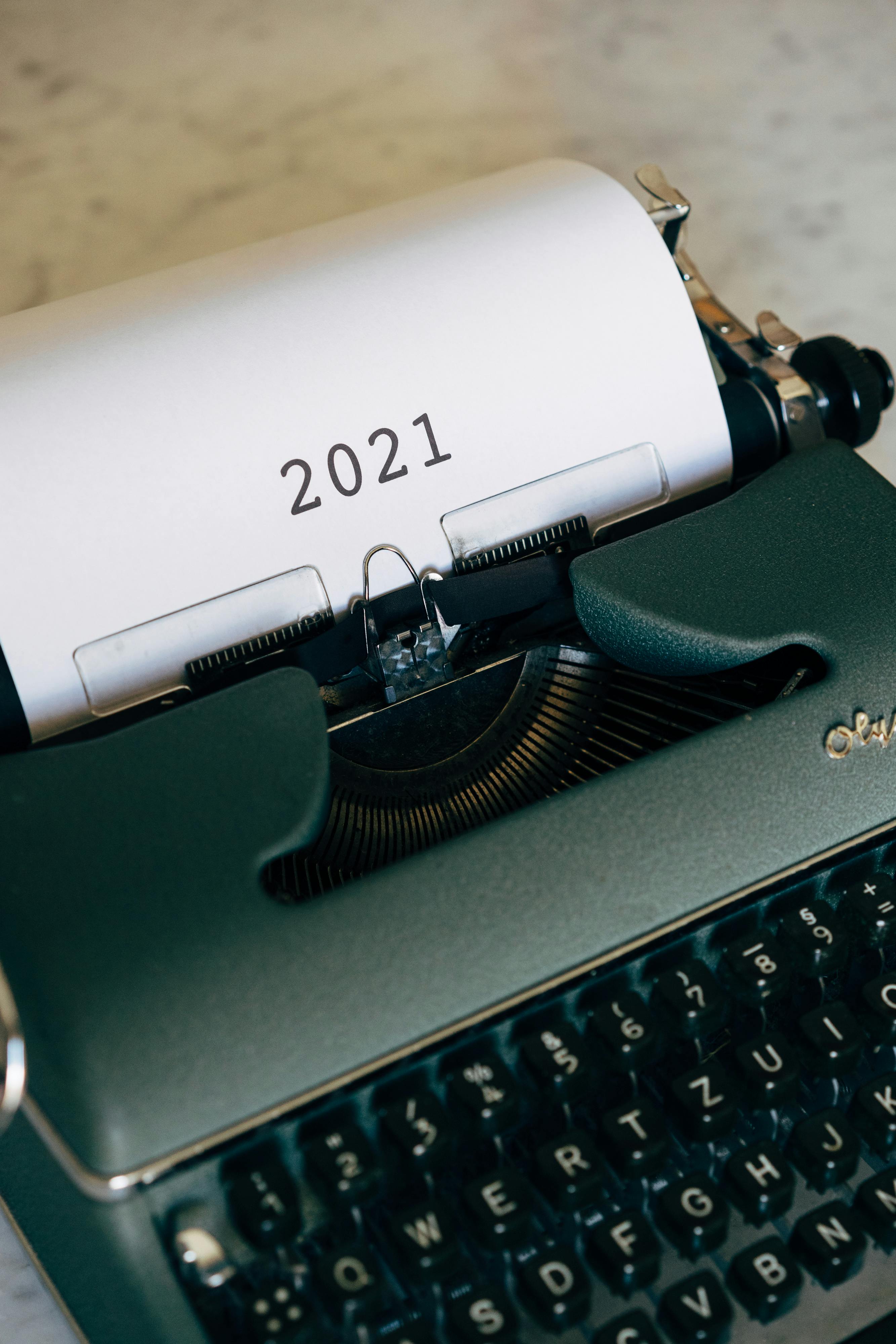 Black Typewriter Machine Typing on White Printer Paper · Free Stock Photo
