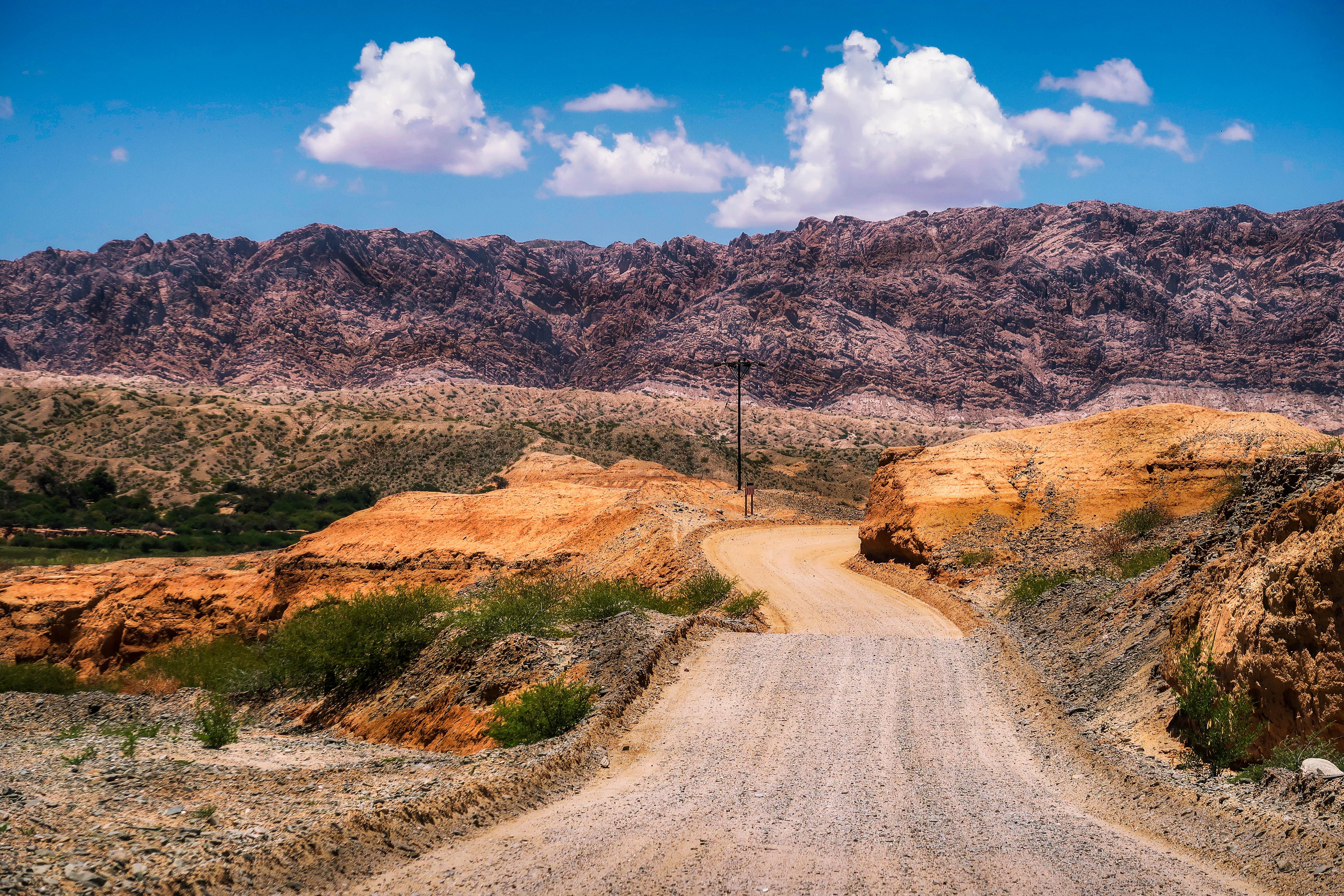 Spectacular mountainous valley with narrow road · Free Stock Photo
