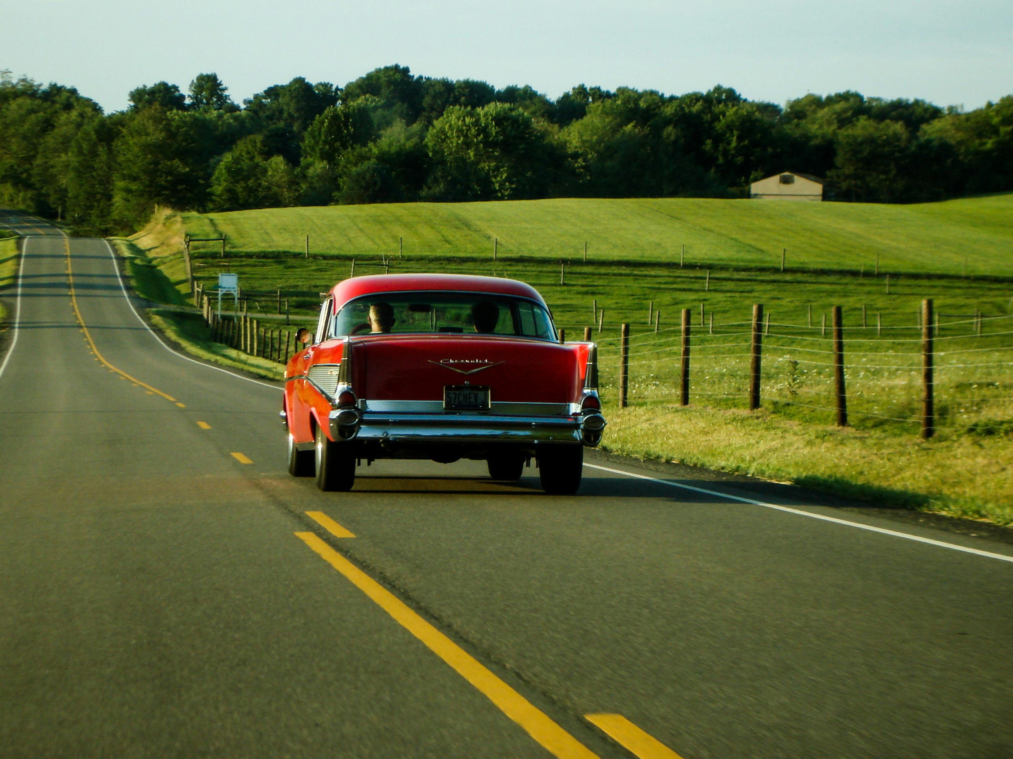 A Red Car on the Road · Free Stock Photo