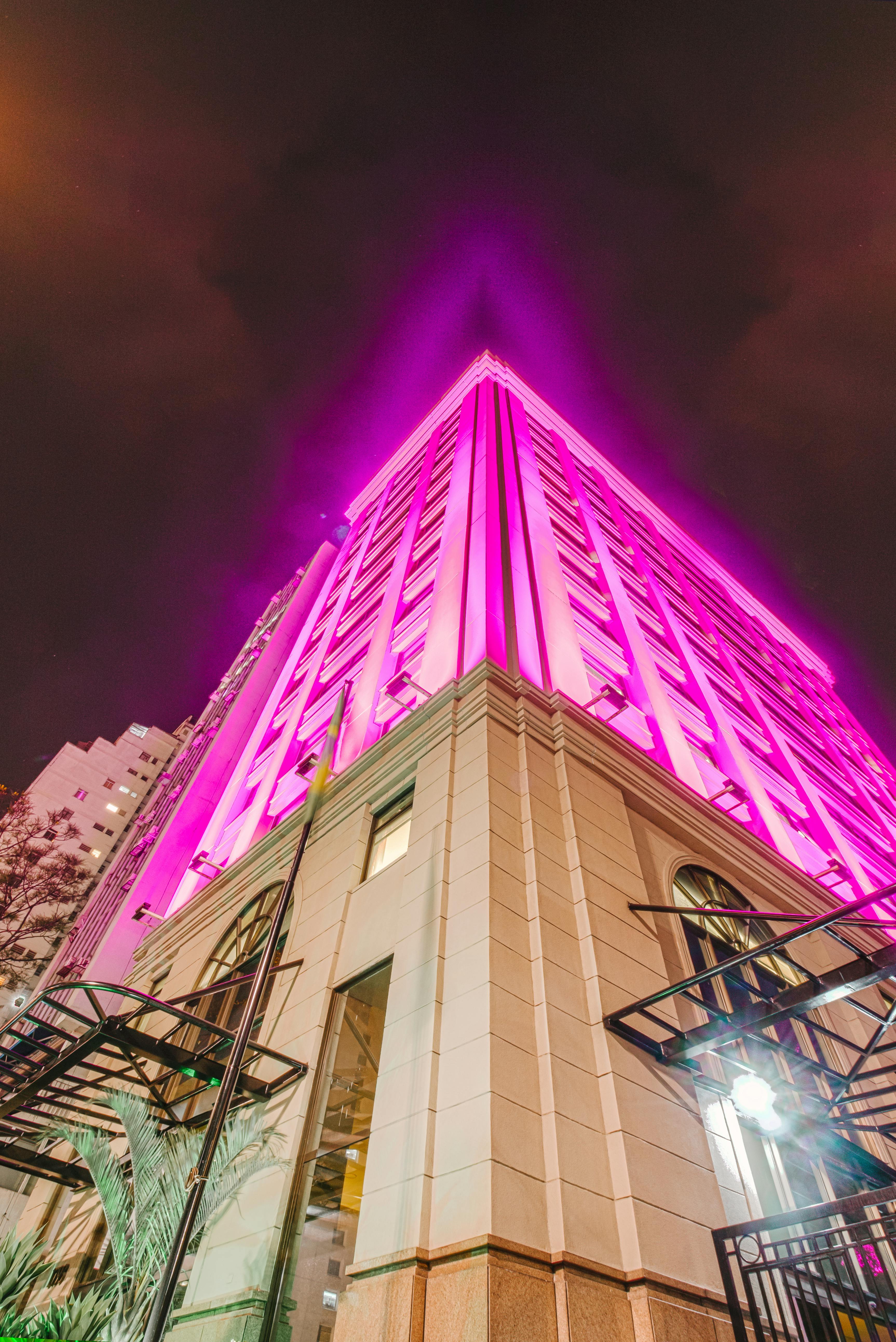 Modern building facade illuminated by bright pink light at night · Free ...