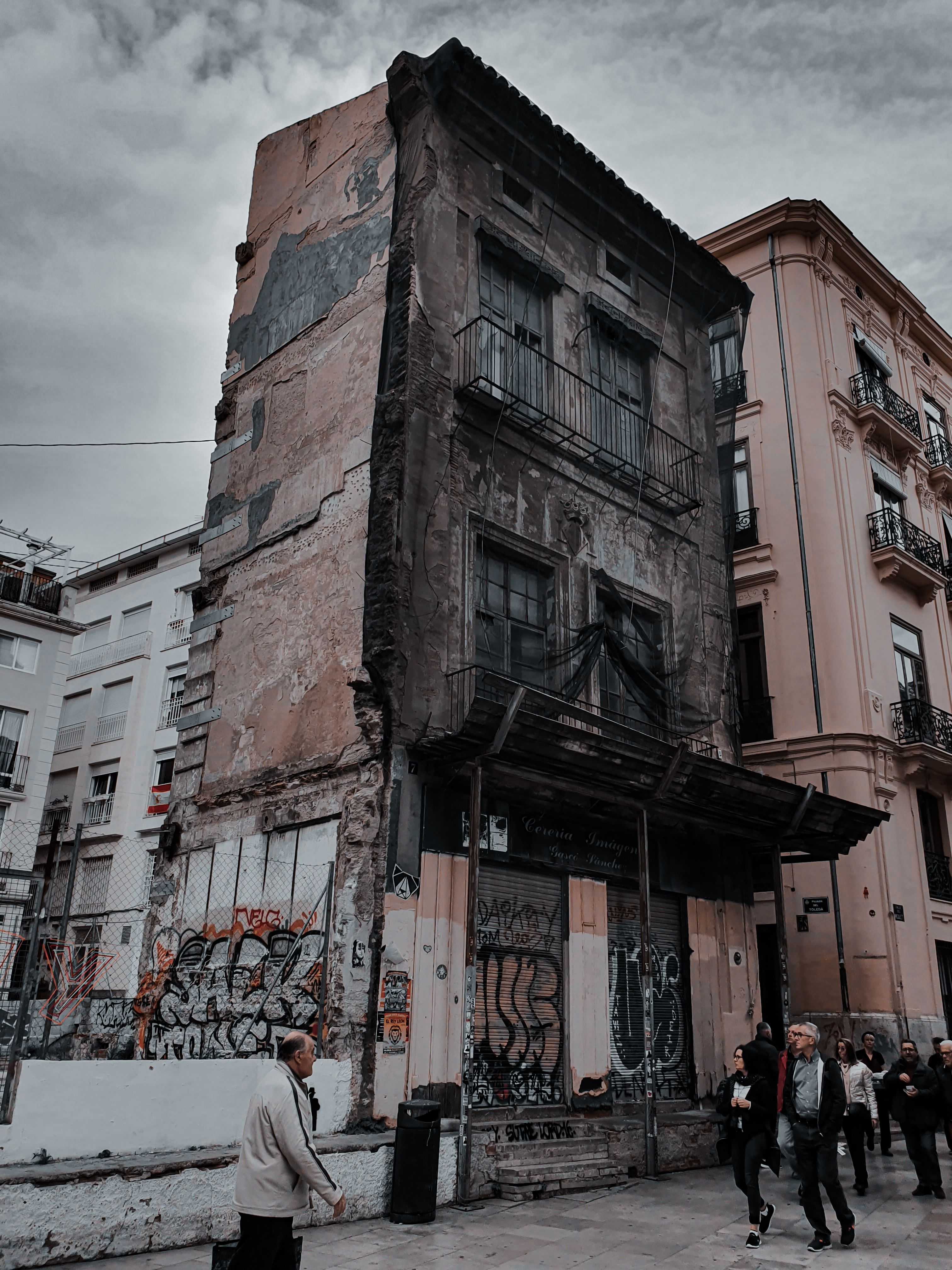 People Walking on the Street between Buildings · Free Stock Photo