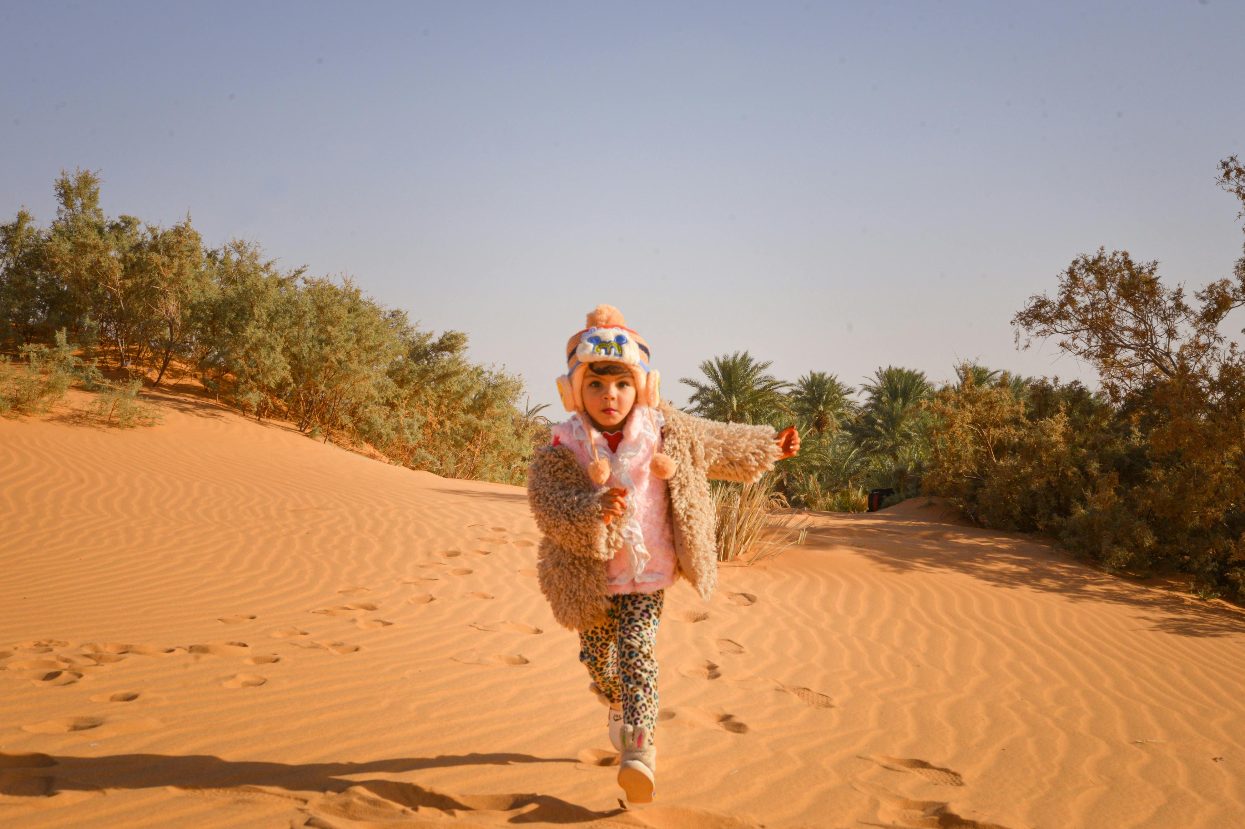 A Kid Running in the Desert · Free Stock Photo