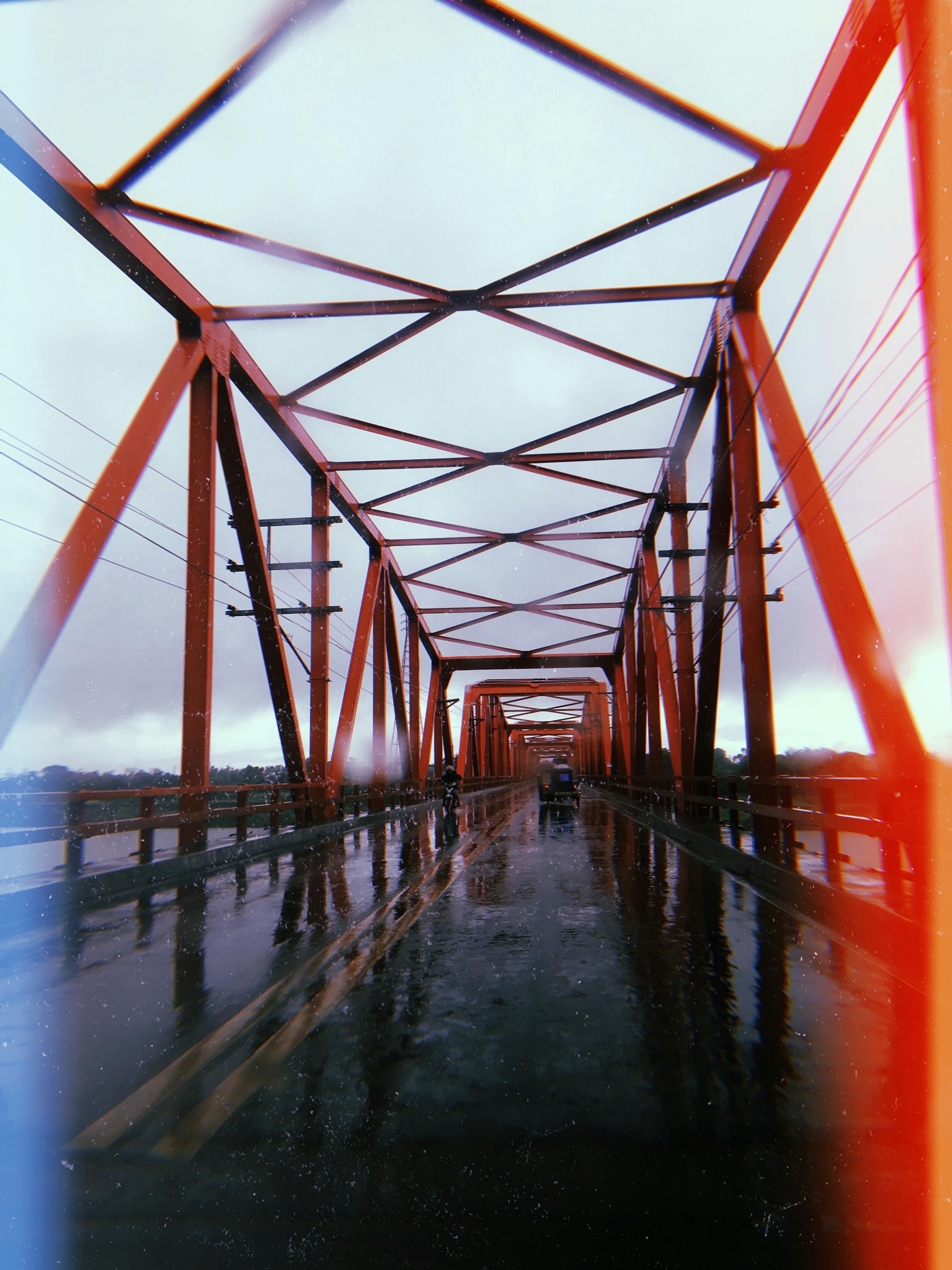 A Wet Orange Steel Bridge On A Rainy Day · Free Stock Photo