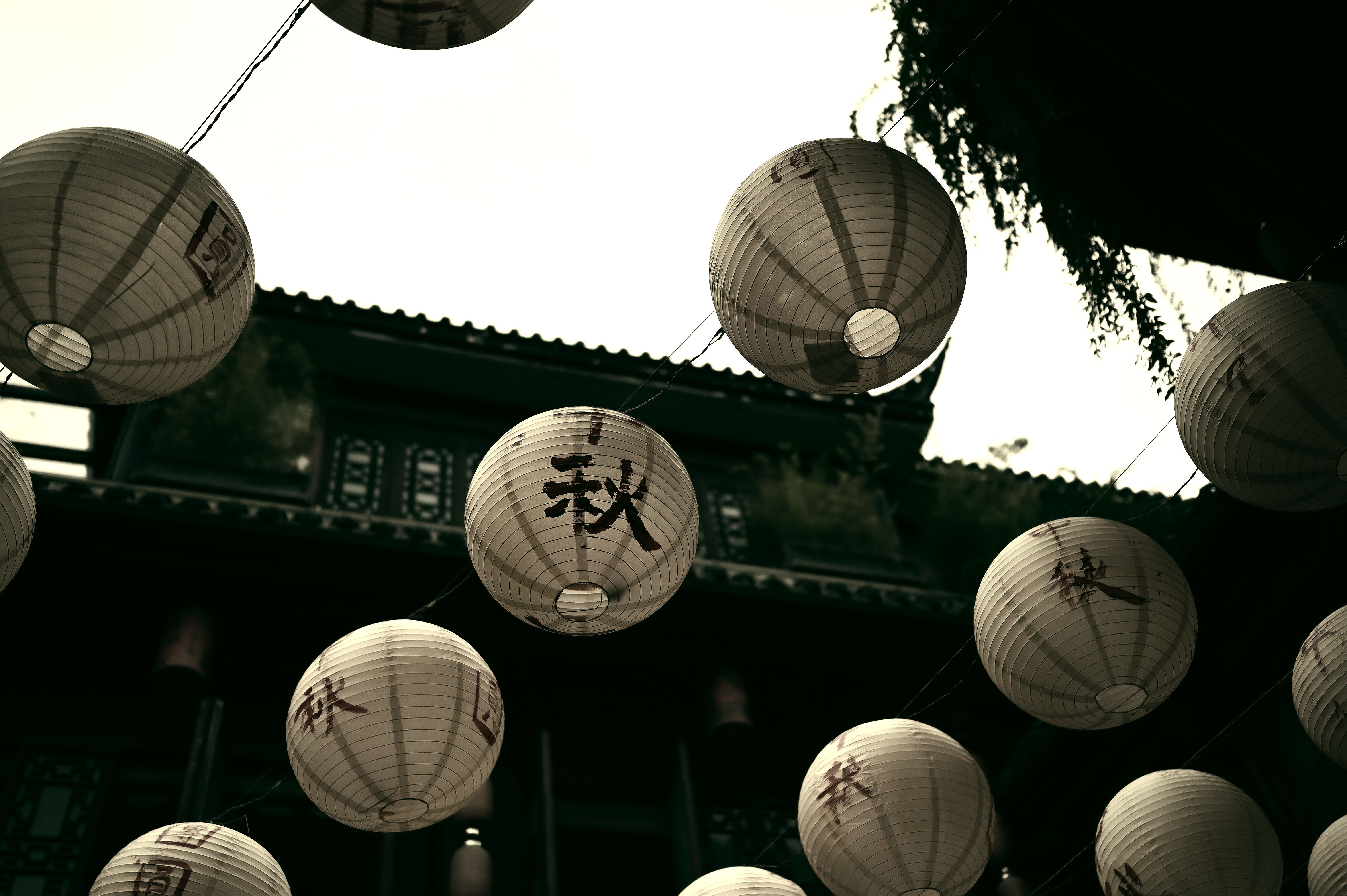 Round paper lanterns decorating street of ancient city · Free Stock Photo