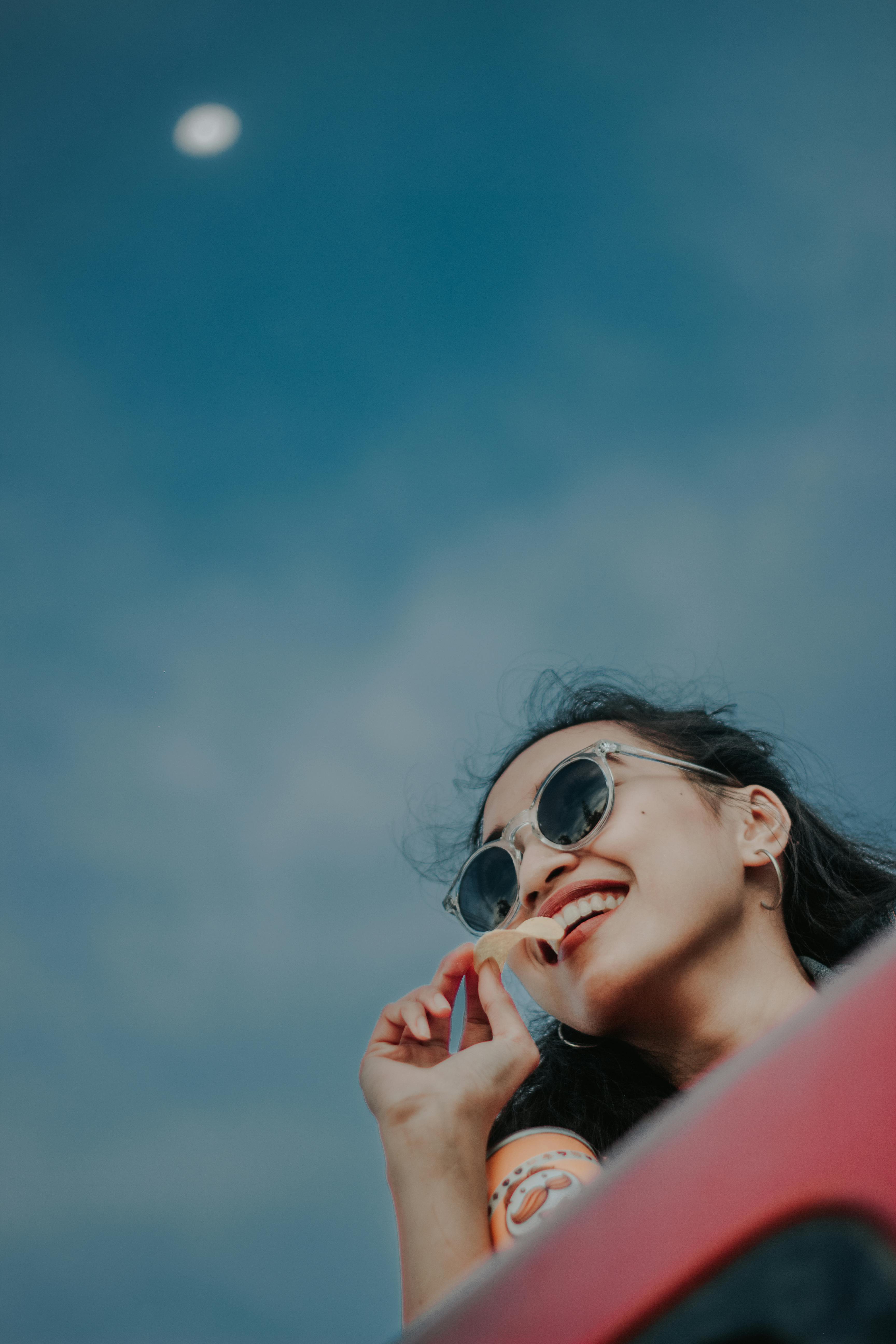 Low Angle Shot of Smiling Woman · Free Stock Photo