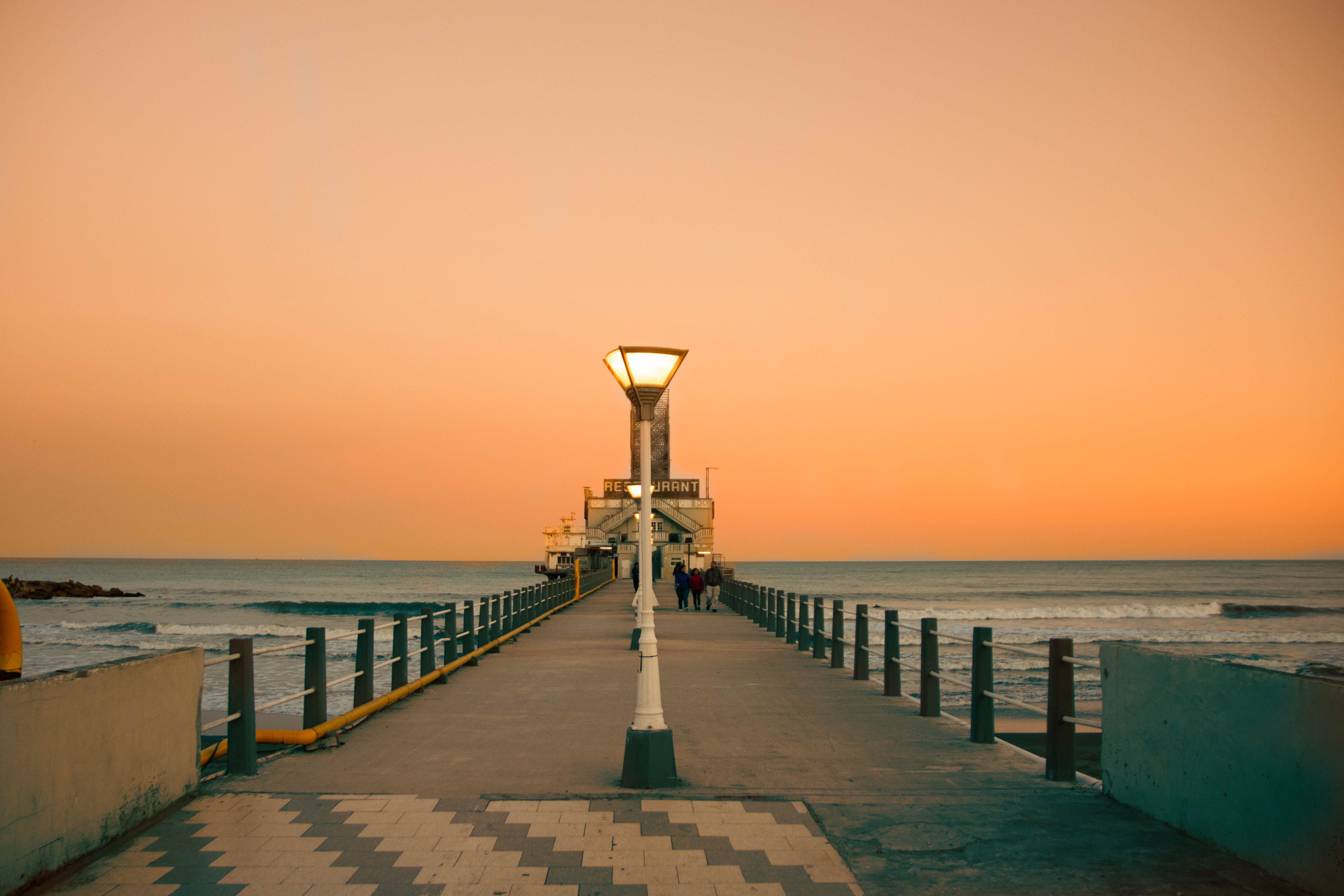 Concrete Dock on Seashore during Dusk · Free Stock Photo