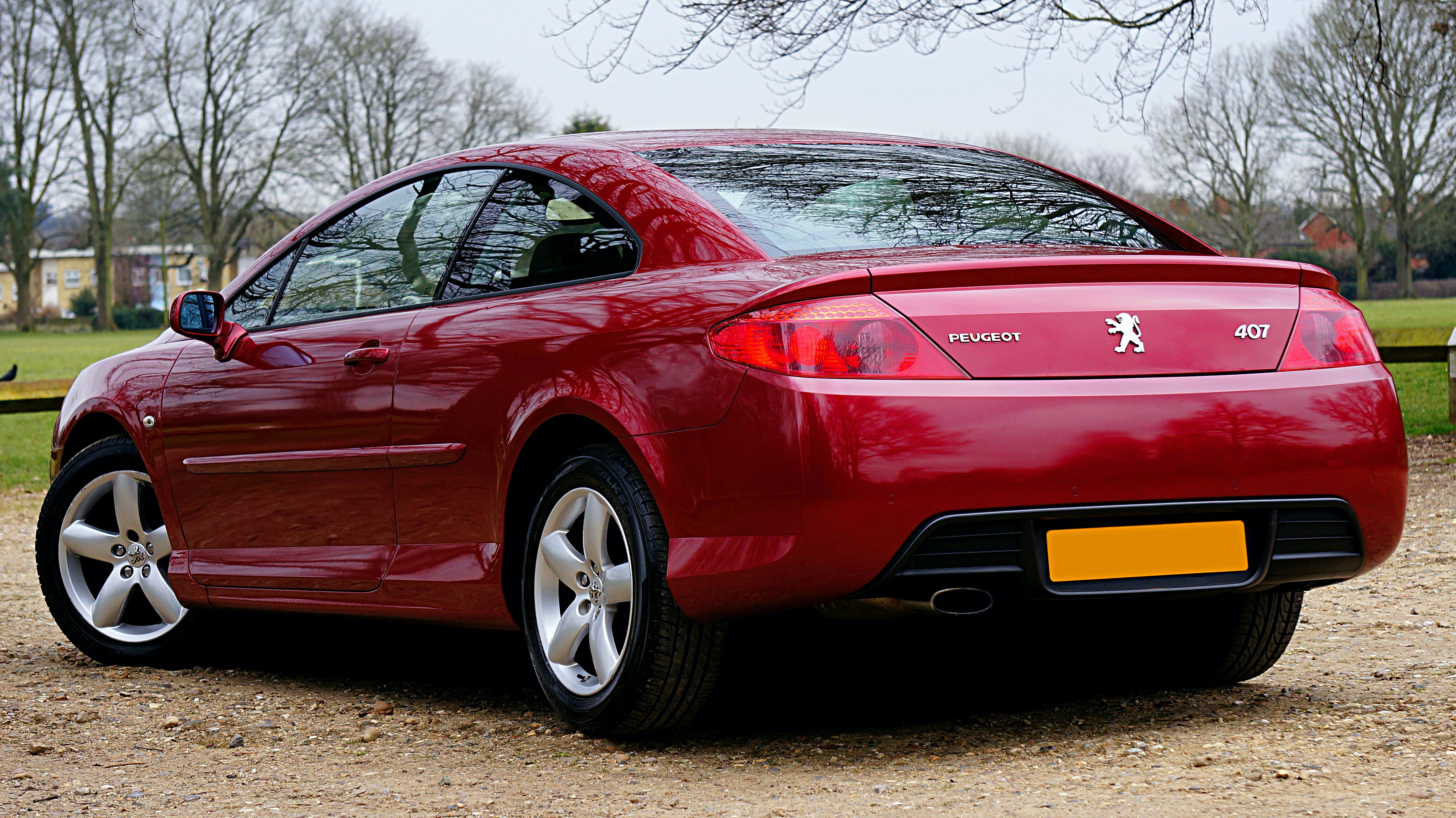 Red Ferrari Parked on a Garage · Free Stock Photo