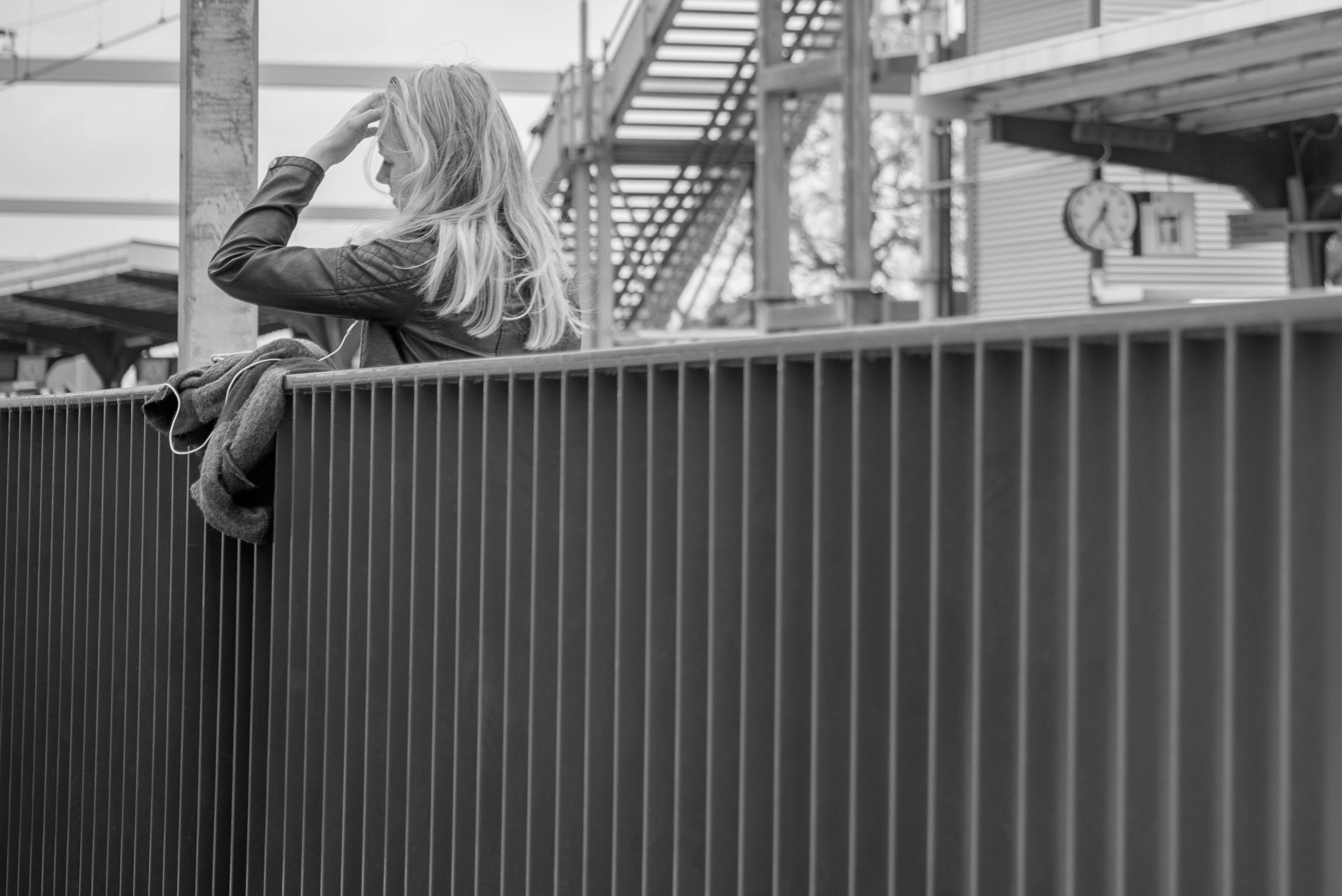 Woman Standing Beside Fence · Free Stock Photo