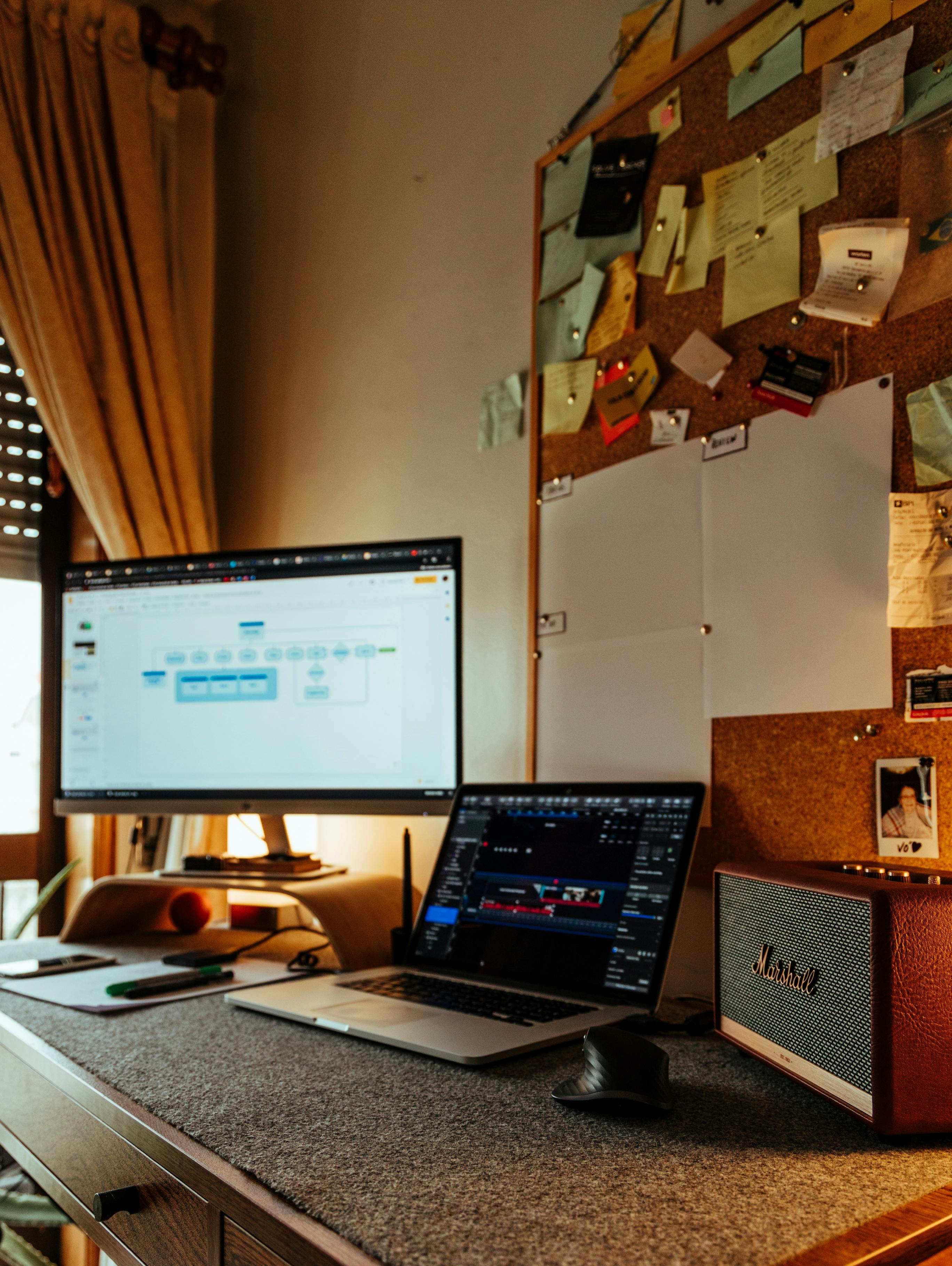 Macbook Pro on Gray Table · Free Stock Photo