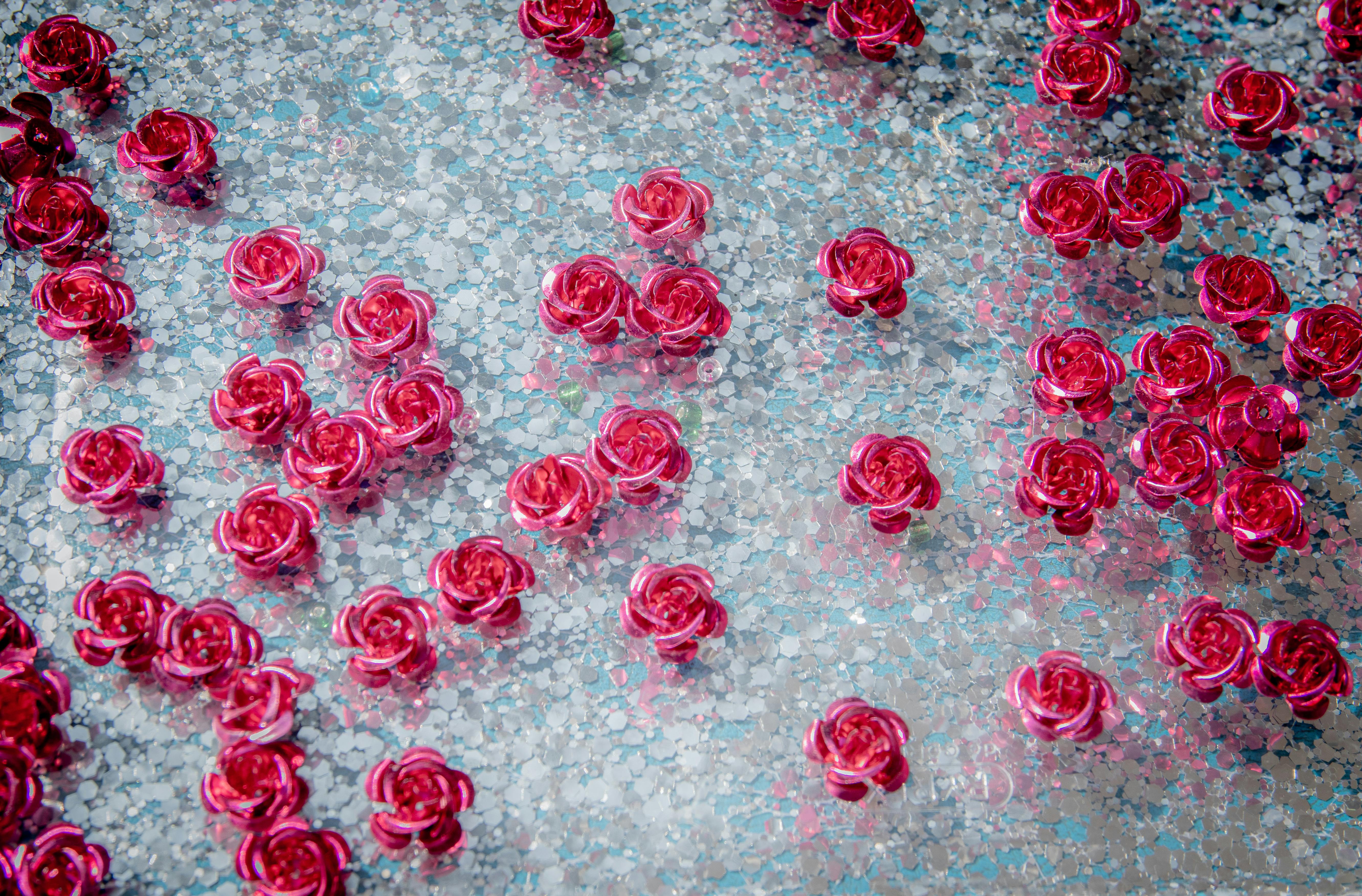 Close-up Photo of Pink Roses and Sparkly Sequins · Free Stock Photo