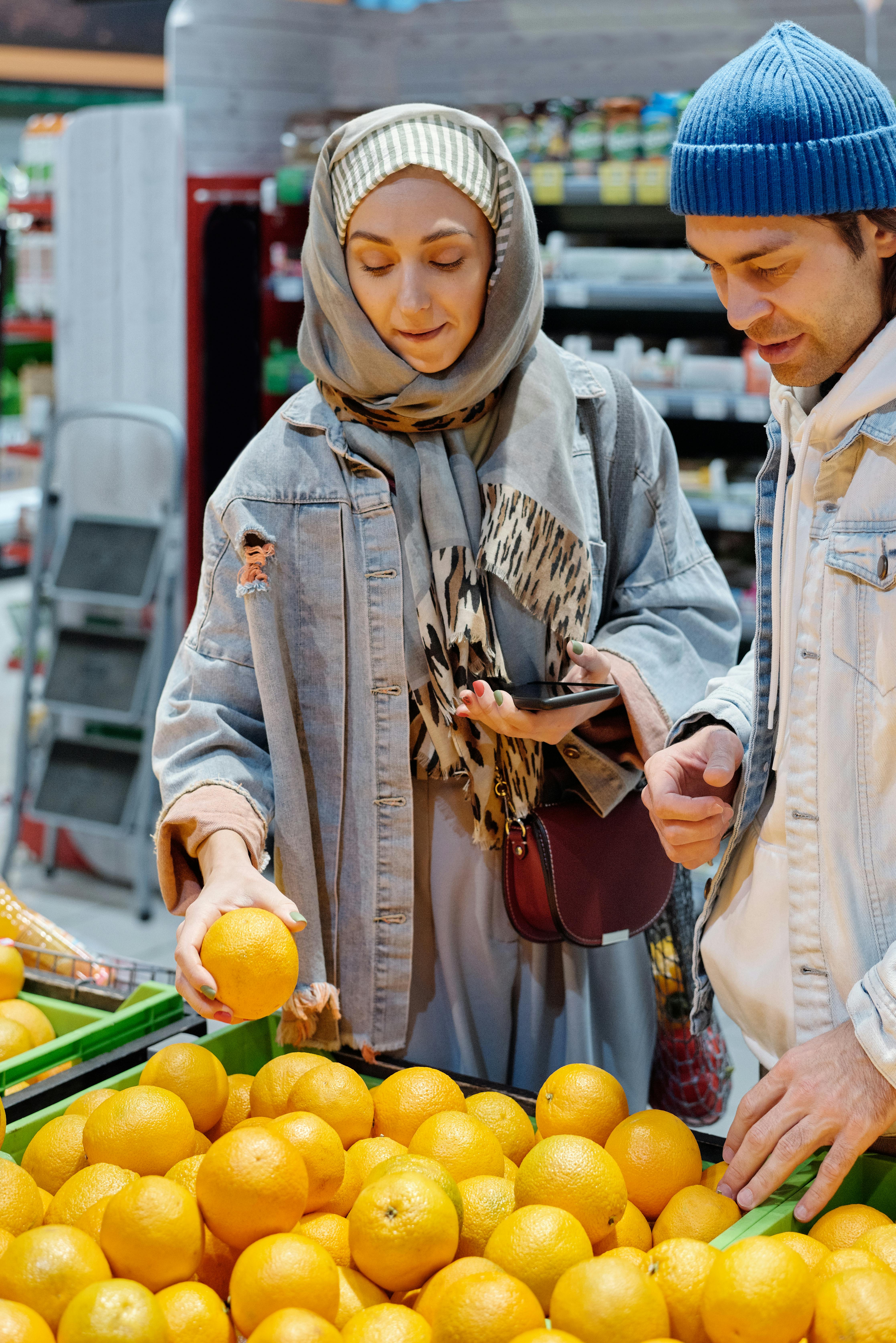 Couple Buying Oranges · Free Stock Photo