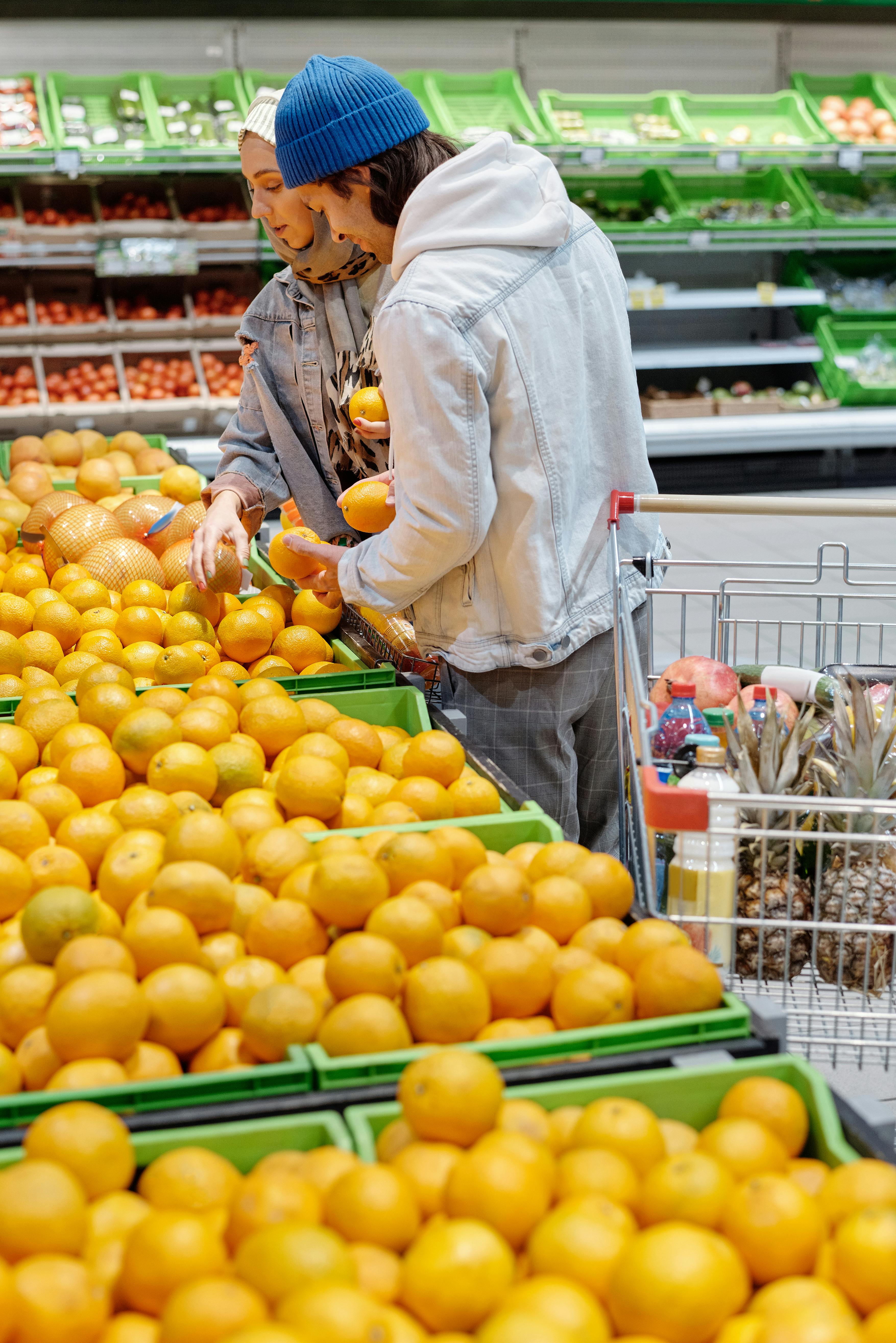 Couple Buying Oranges · Free Stock Photo