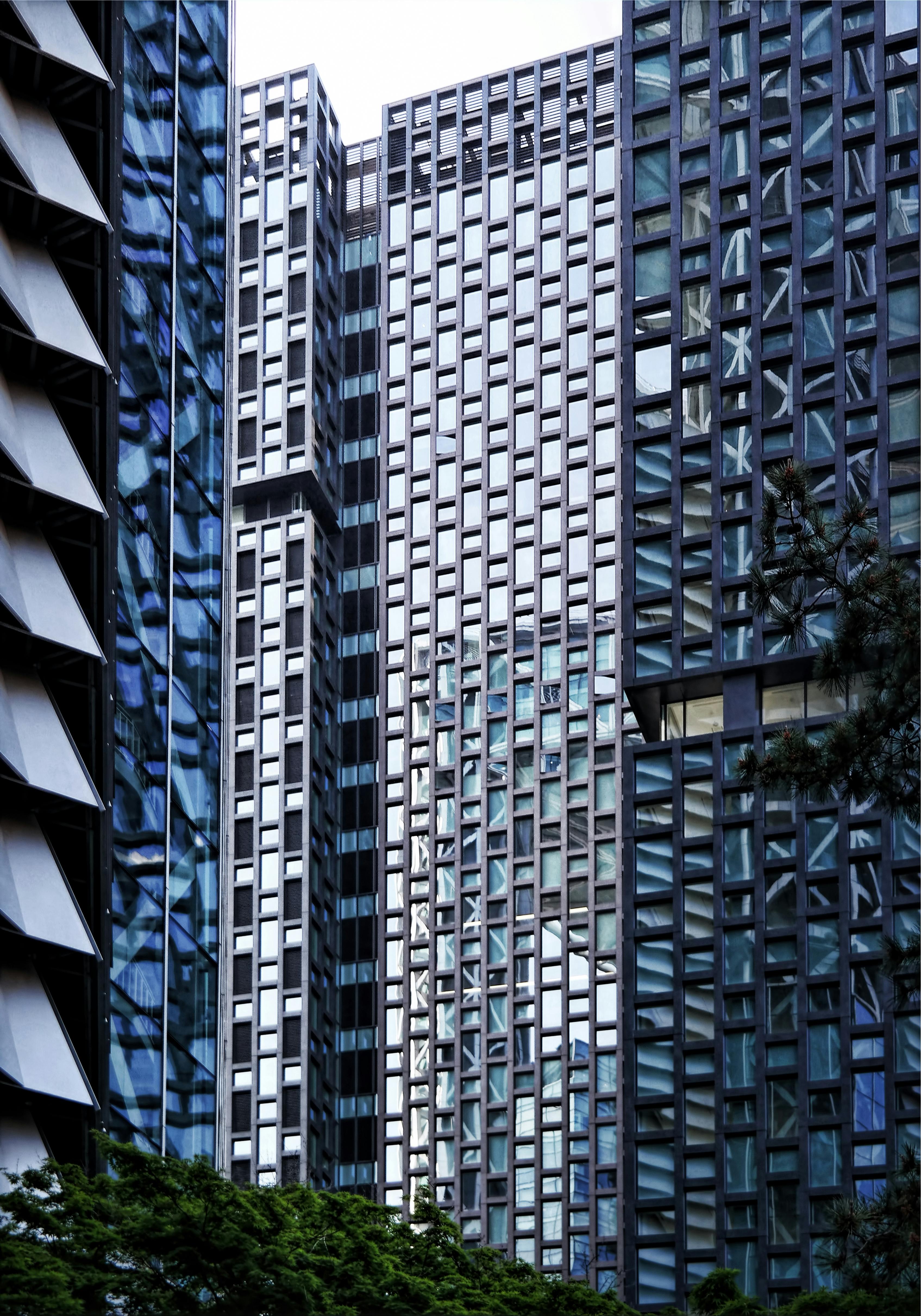 Grey Concrete Round High Rise Building · Free Stock Photo