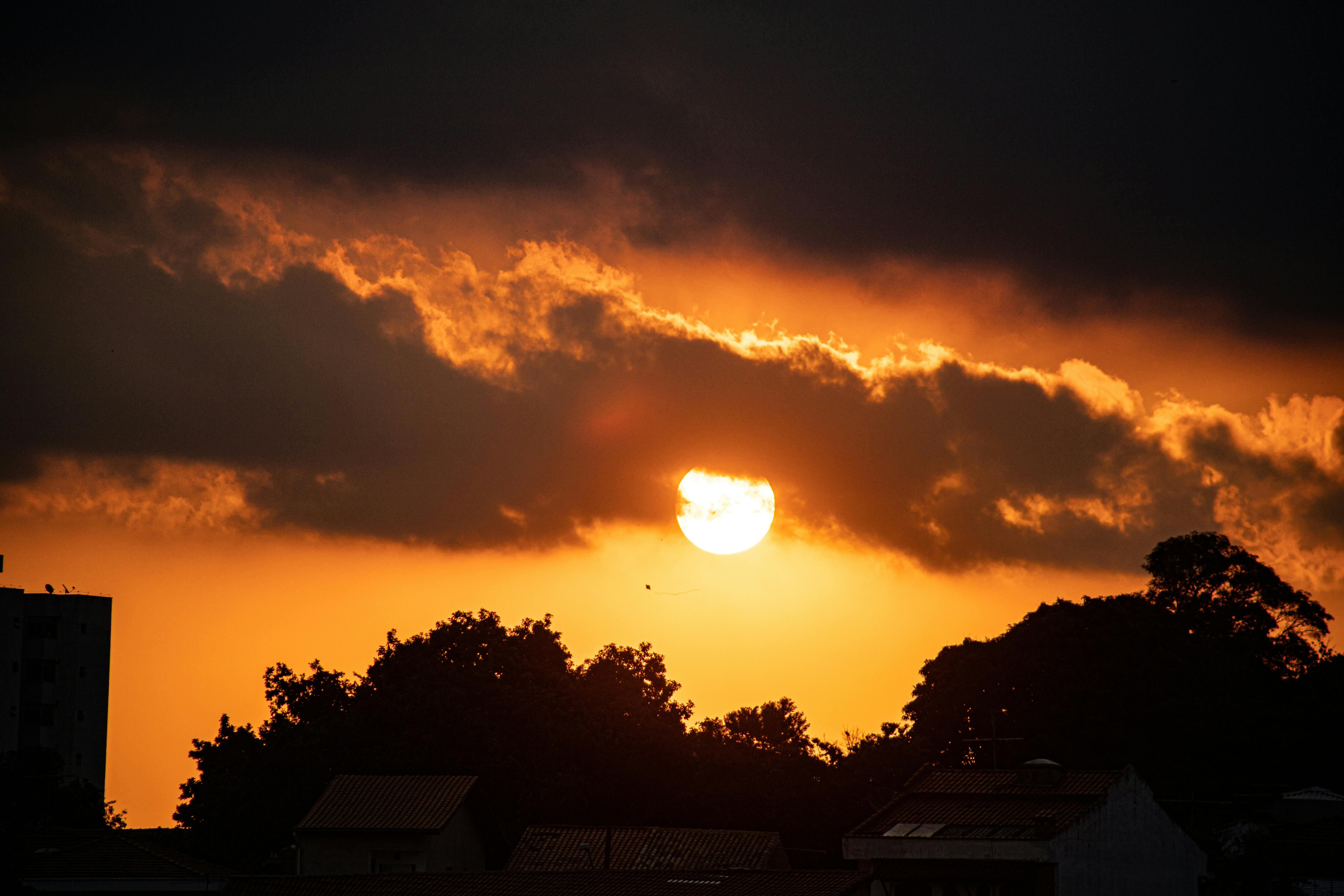 Scenic sunset sky over countryside settlement · Free Stock Photo