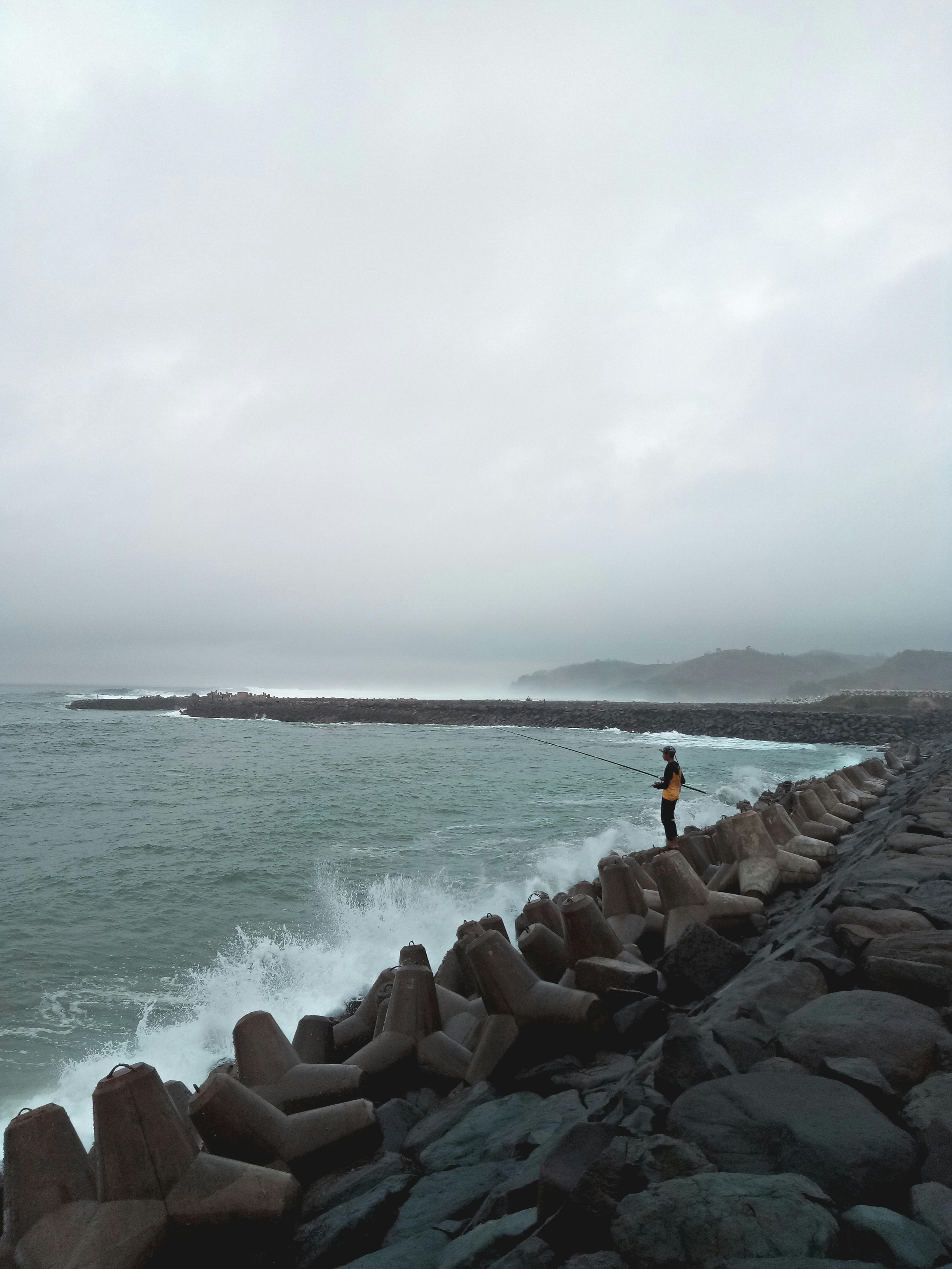 Person standing on Barriers · Free Stock Photo