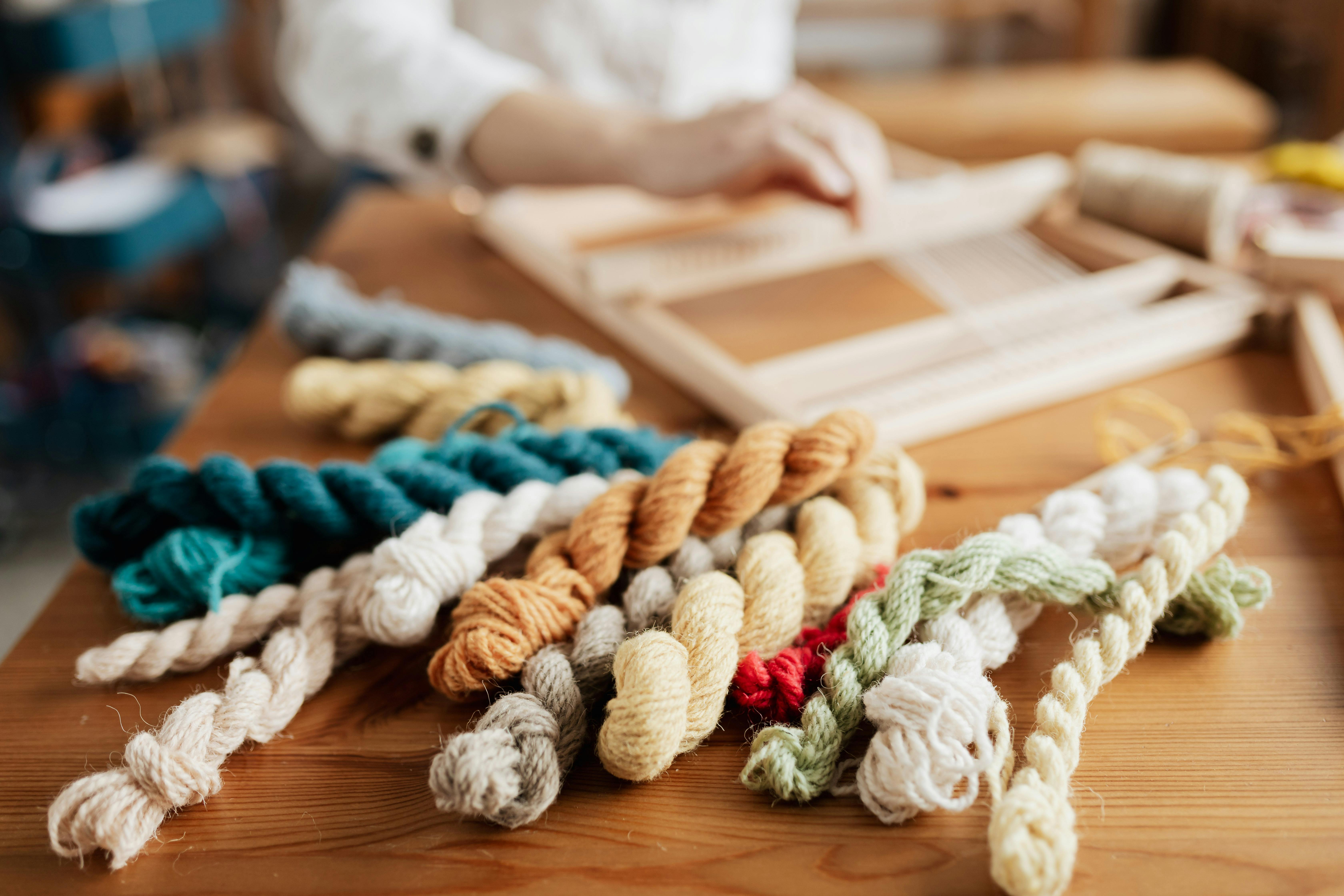 Close-Up Photo of Ropes on Wooden Table · Free Stock Photo
