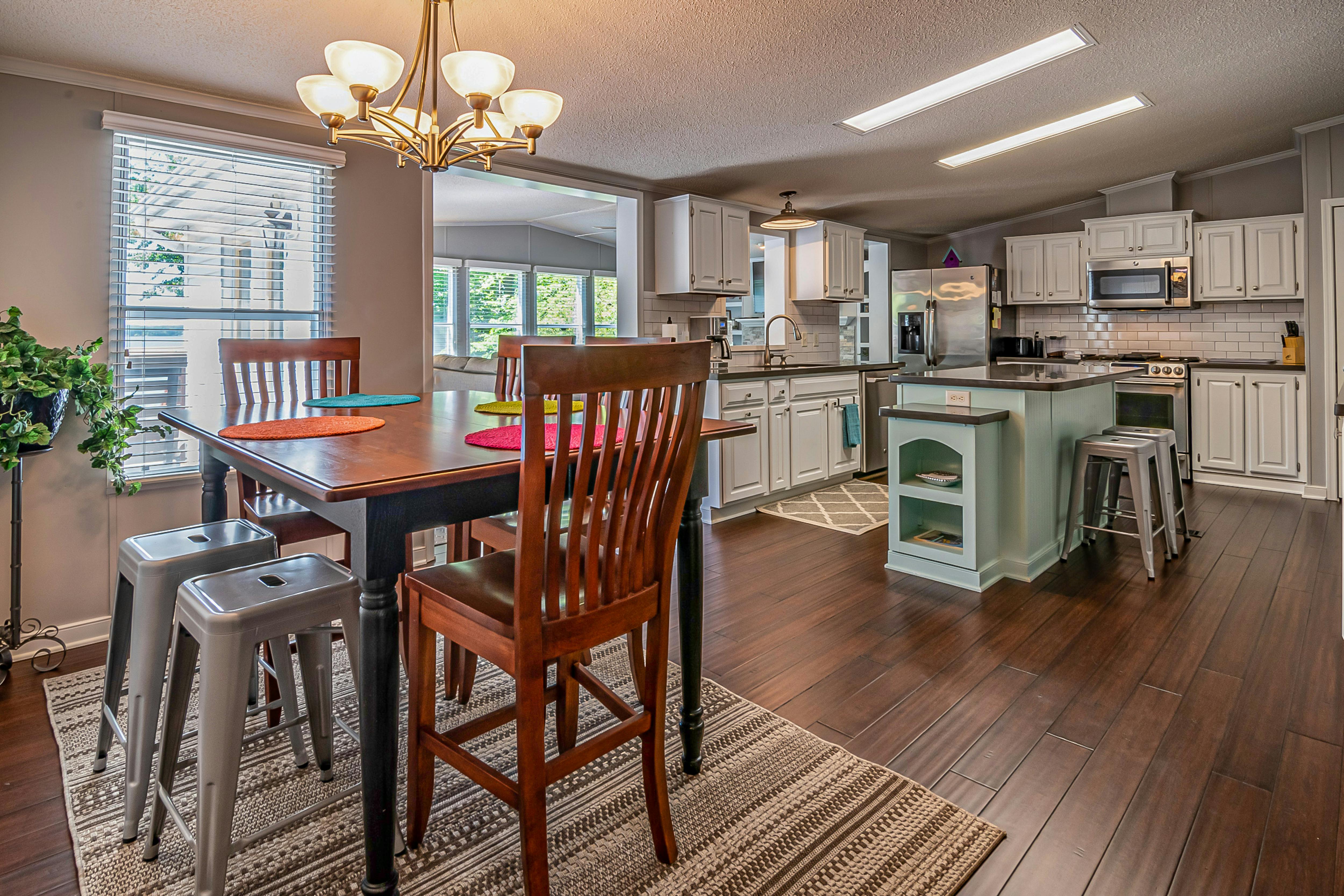 A Brown High Wooden Table and Chairs in a Kitchen · Free Stock Photo