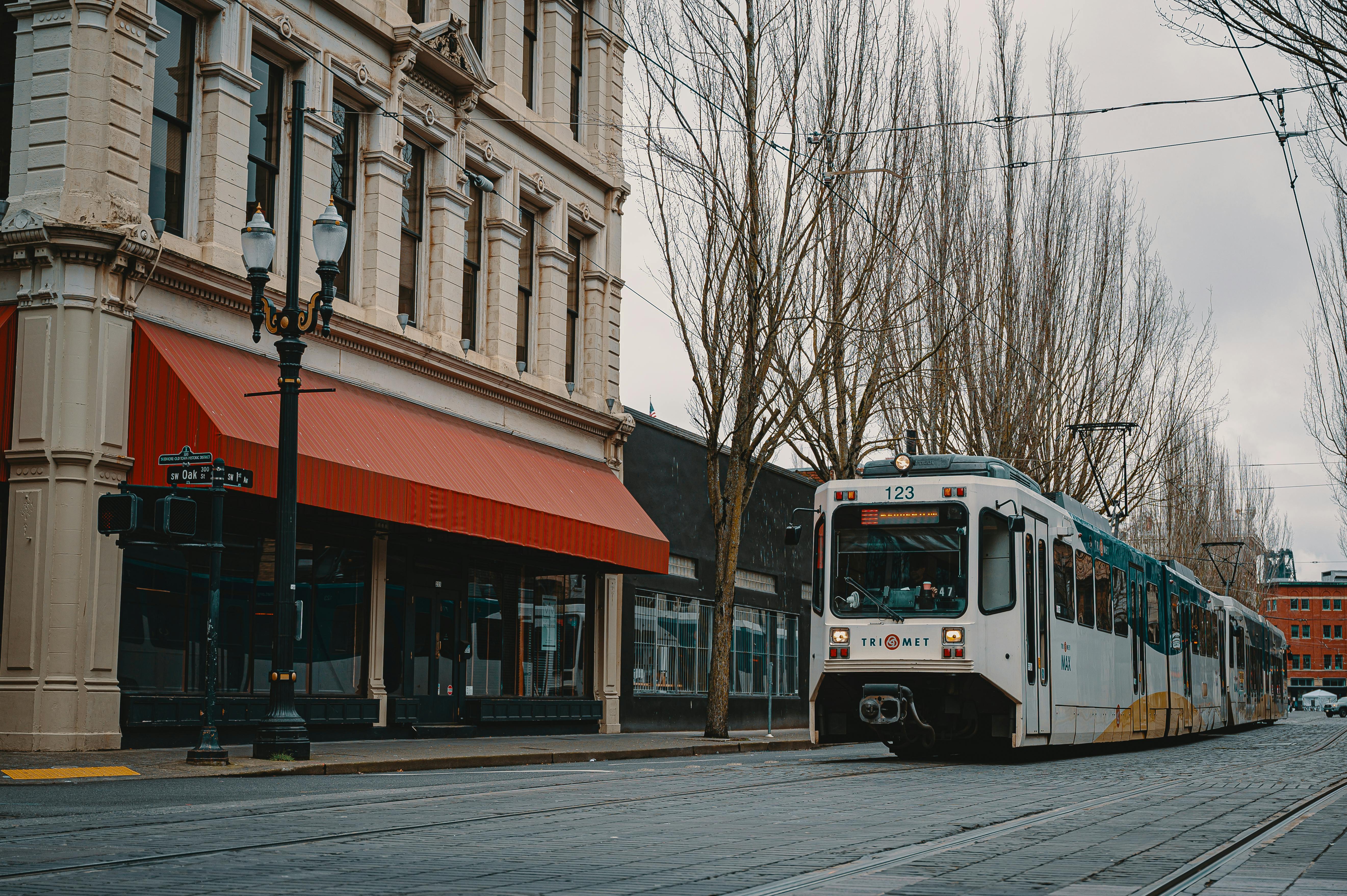 Tram riding on railroad in city · Free Stock Photo