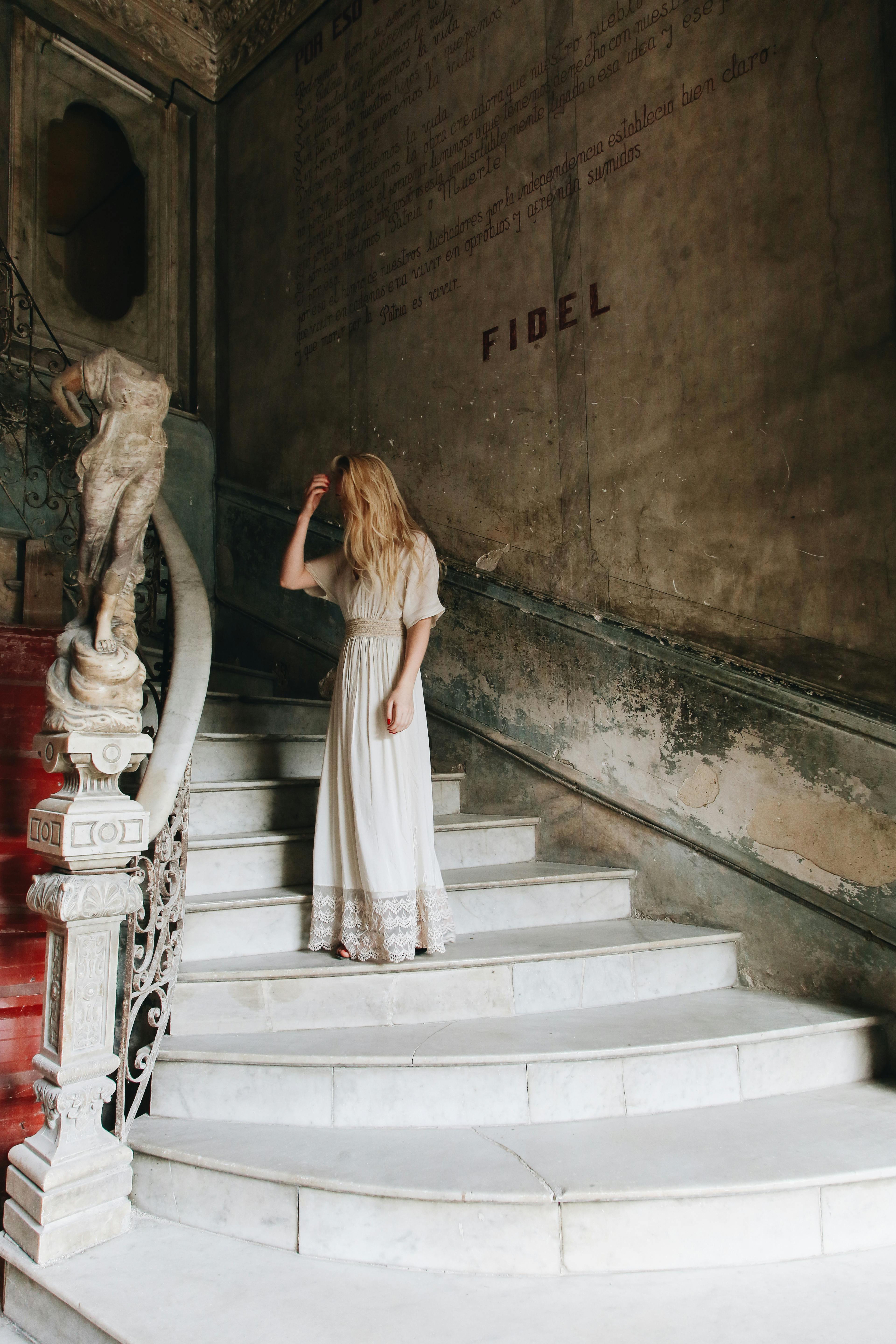 Woman in Dress on Stairs · Free Stock Photo