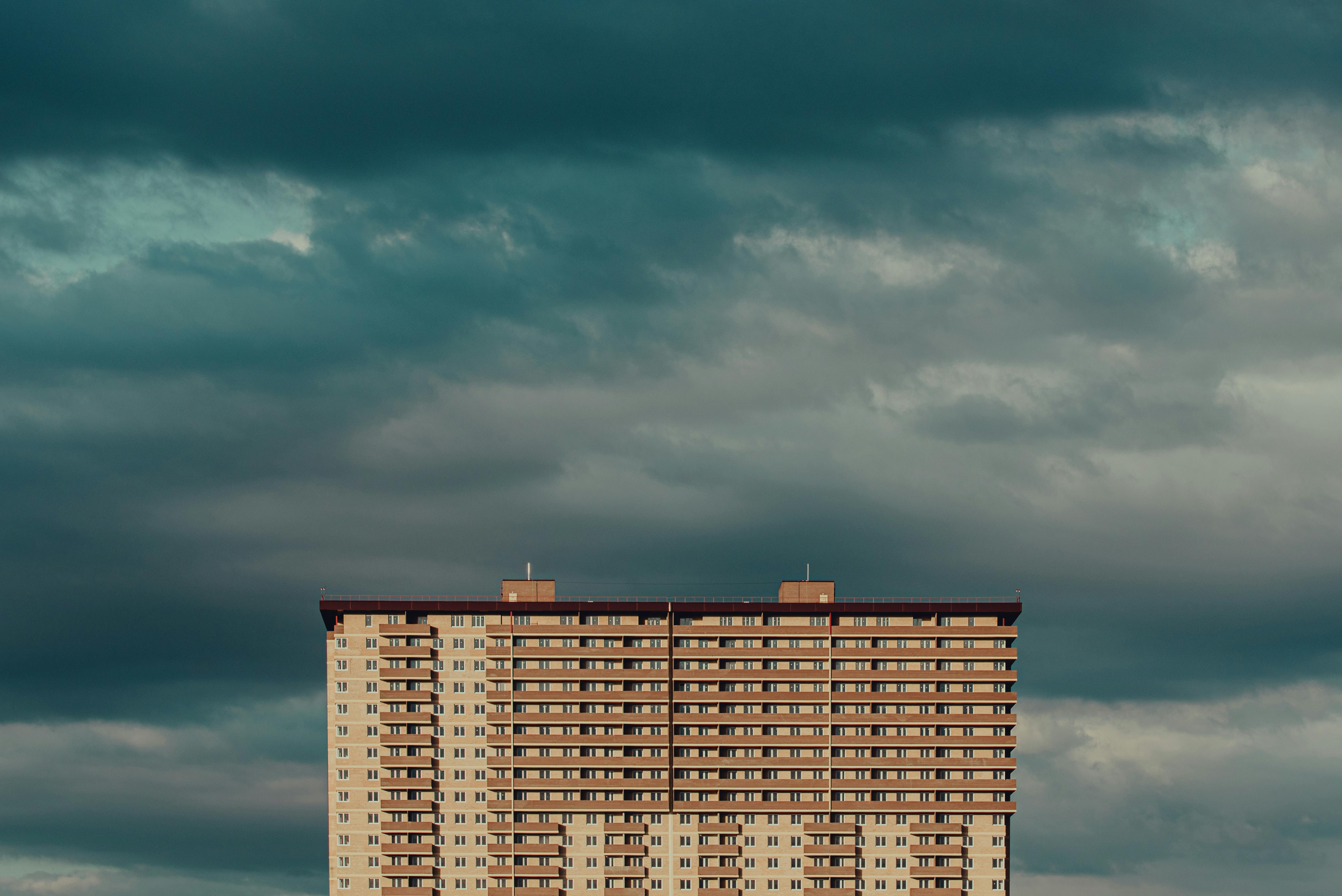 Residential Buildings Under Cloudy Sky · Free Stock Photo