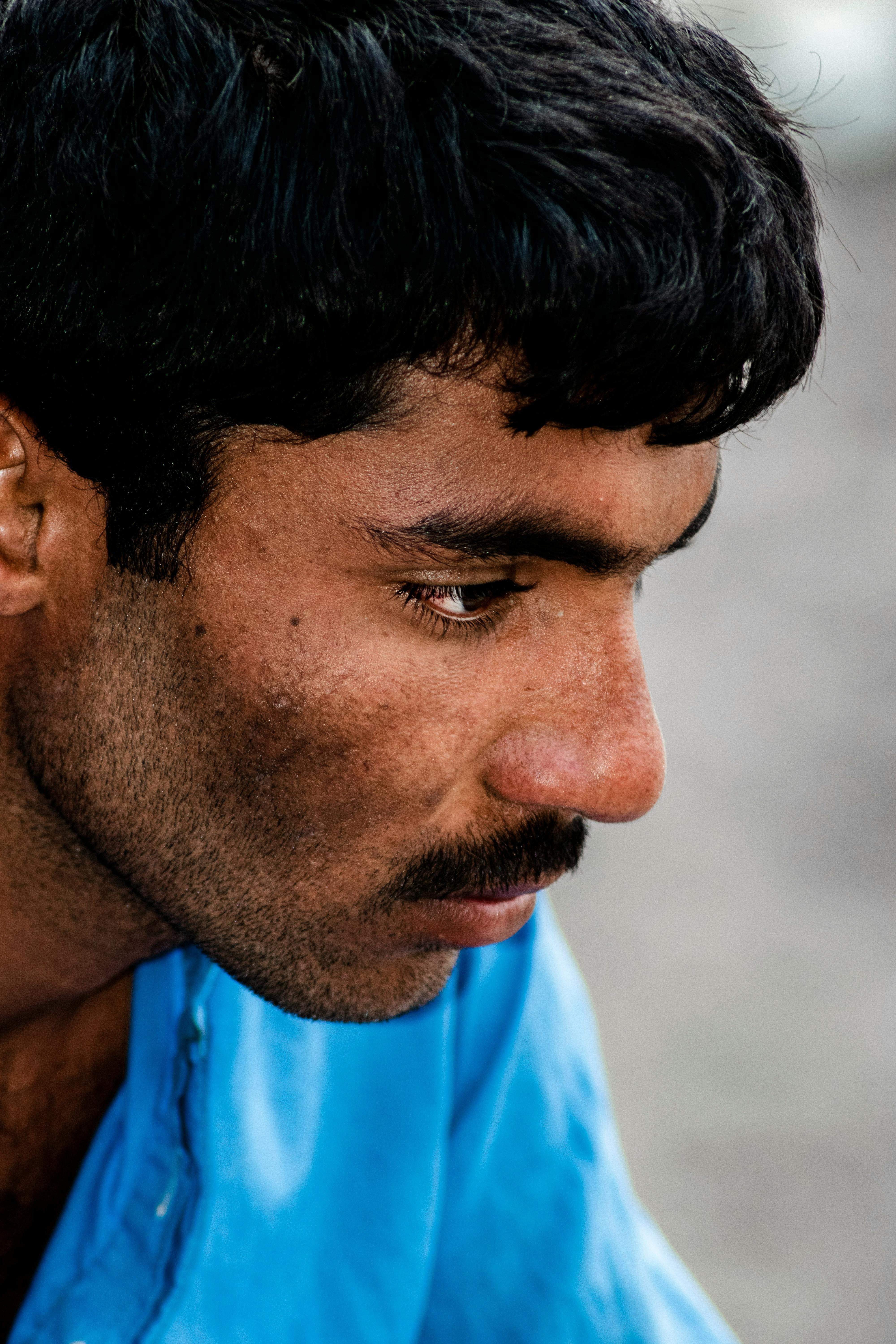 Serious ethnic man on street in daytime · Free Stock Photo