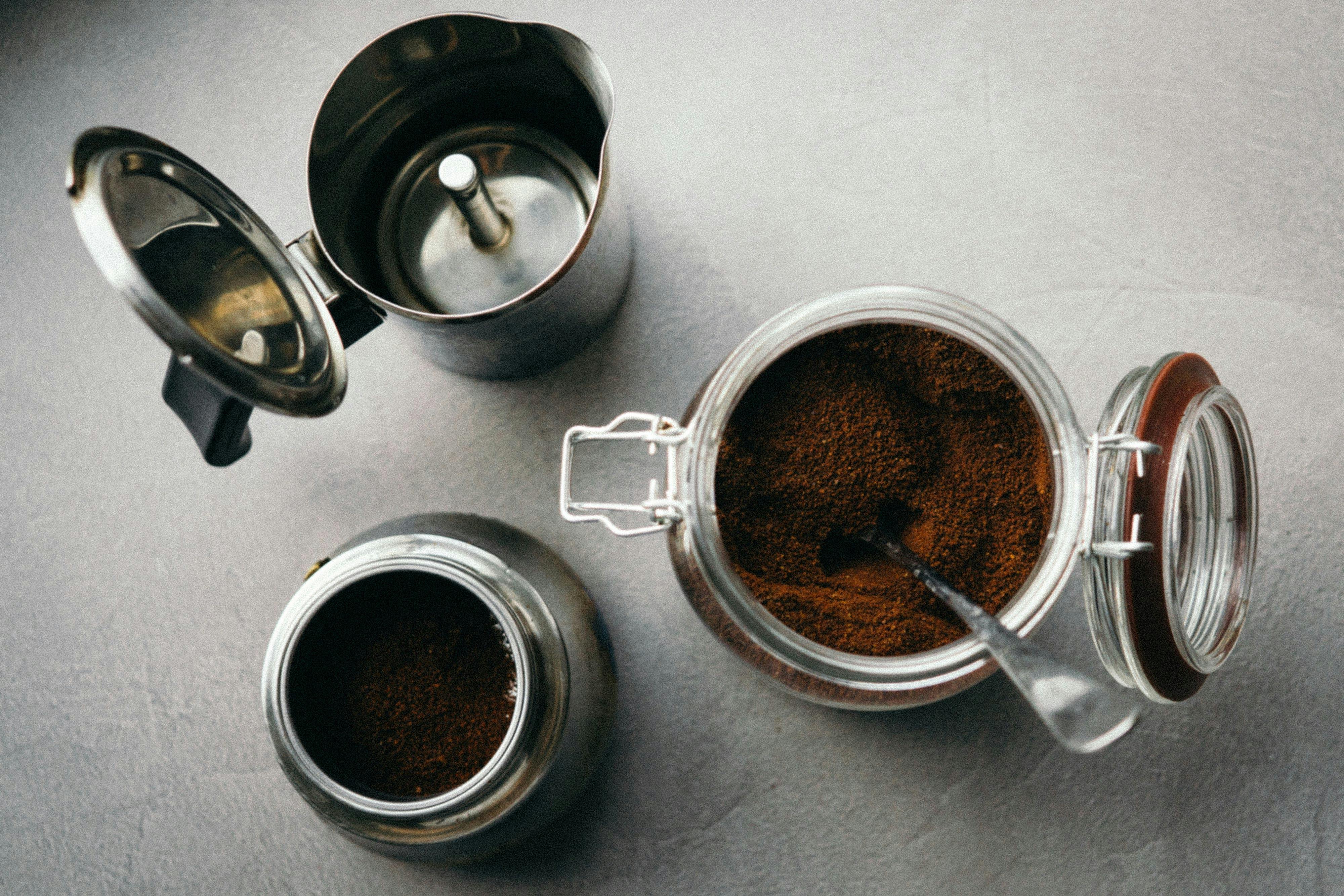 Top View of Ground Coffee and a Moka Pot · Free Stock Photo