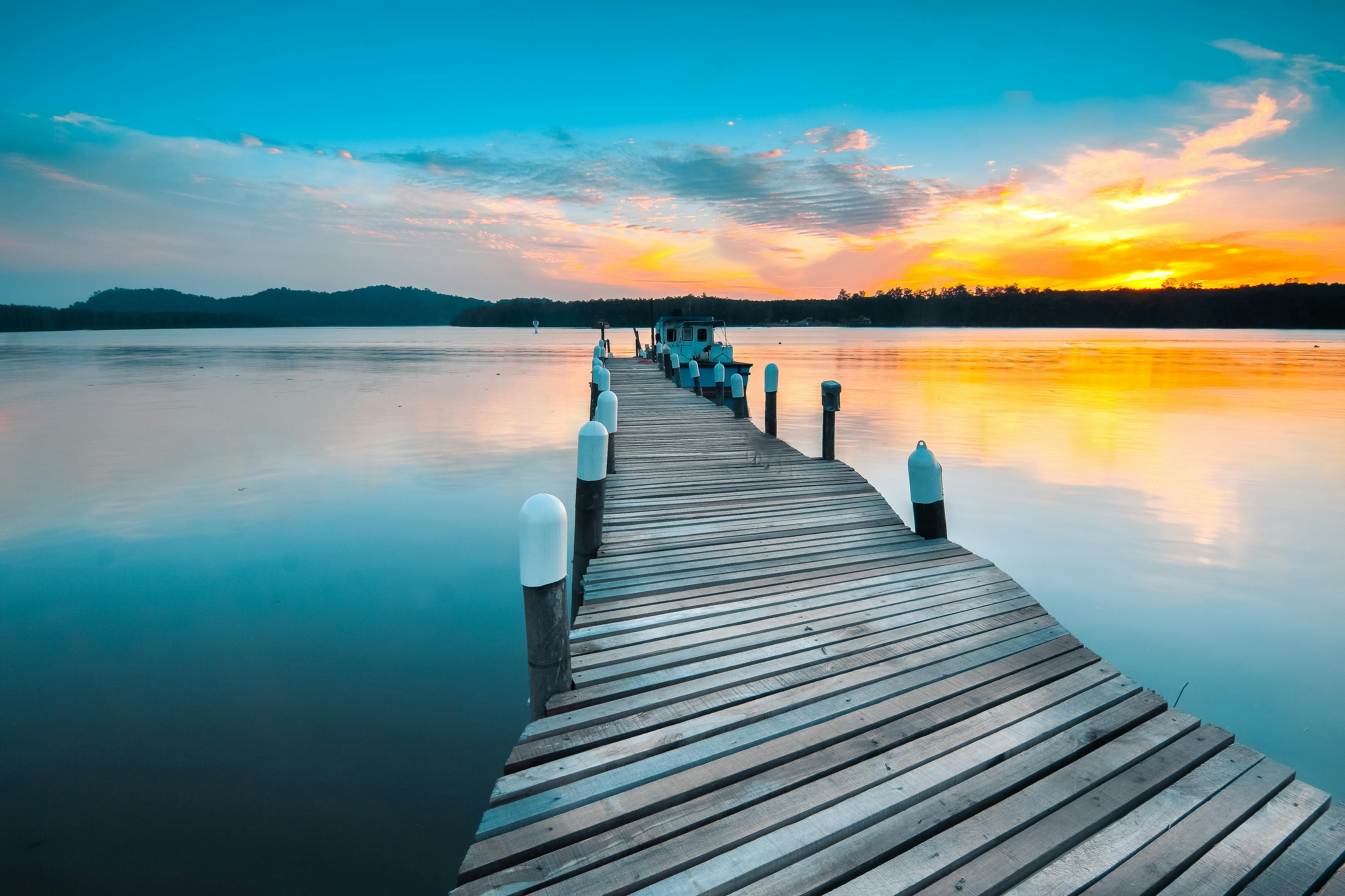 Brown Wooden Dock over Body of Water · Free Stock Photo