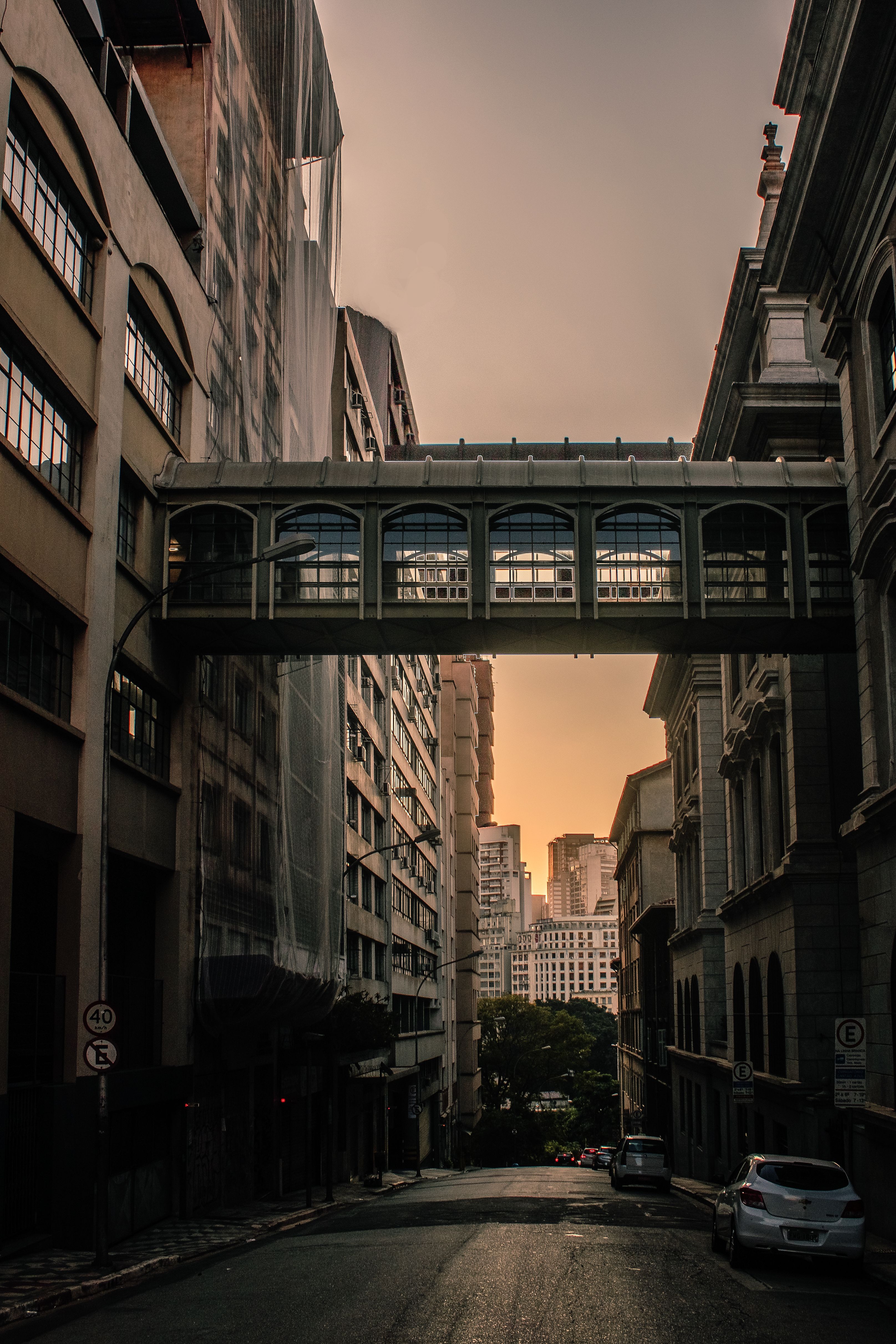 Street of residential district with overhead passage · Free Stock Photo