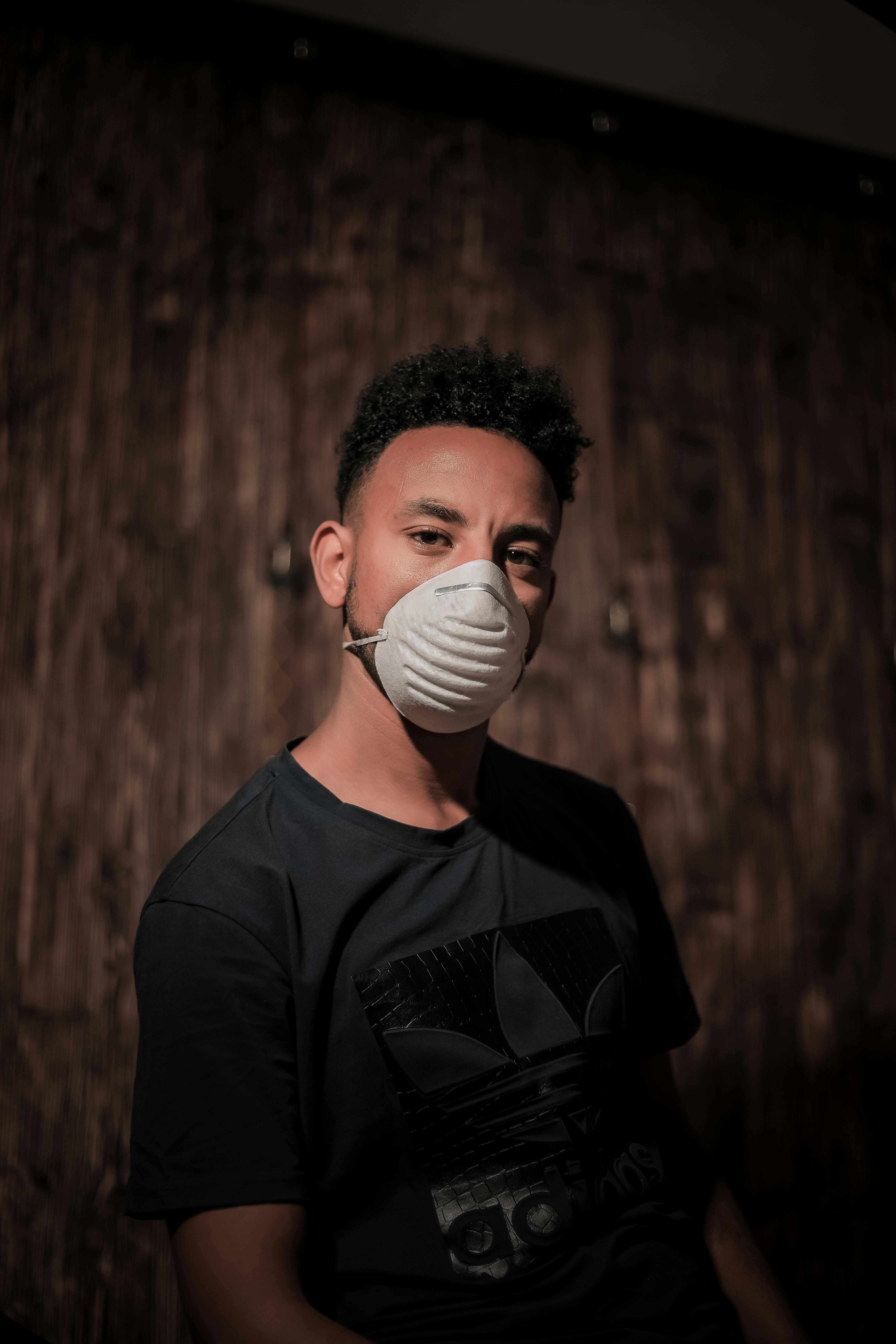 A Portrait of a Young Man in a Face Mask · Free Stock Photo