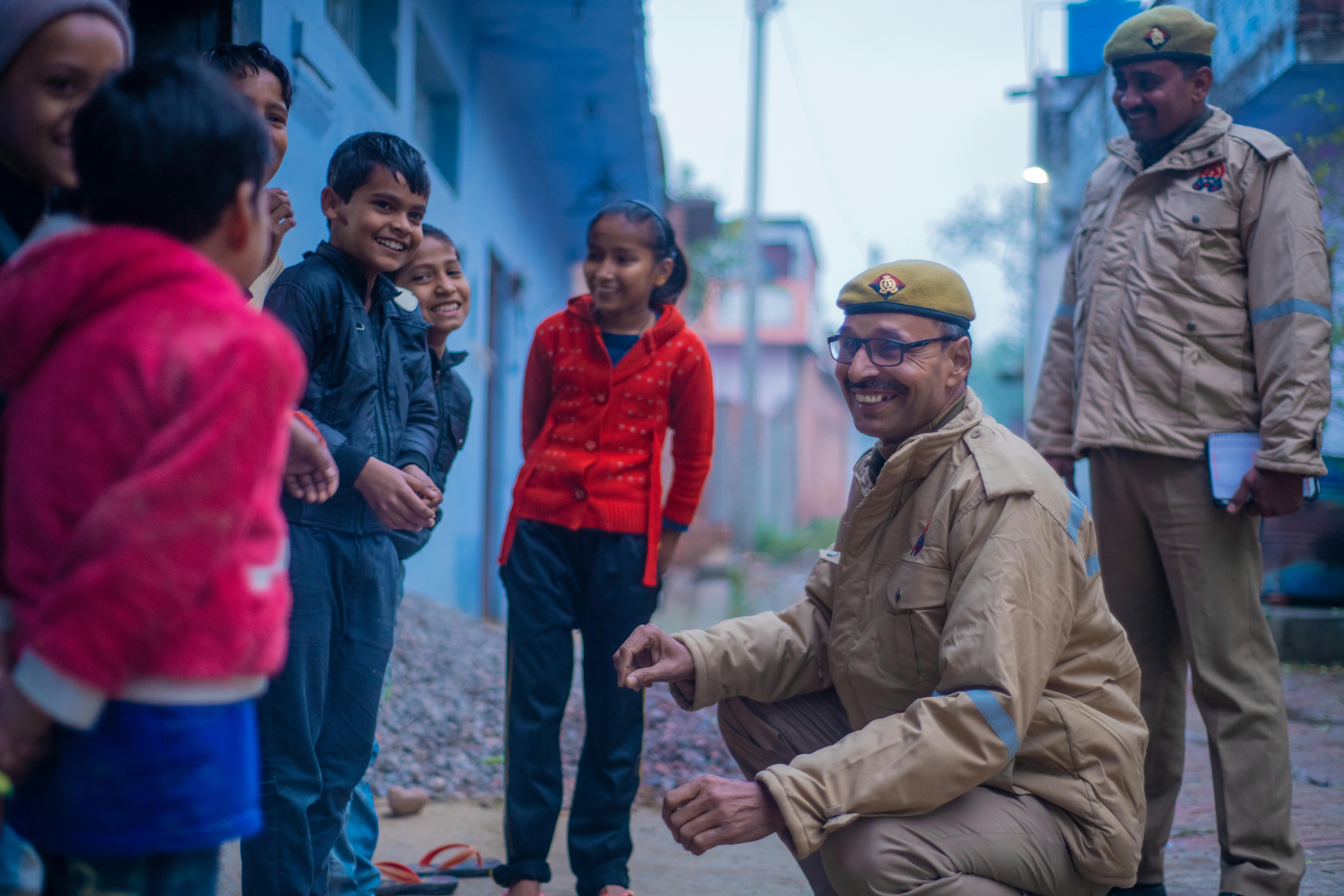 Policemen Smiling at Young Children · Free Stock Photo