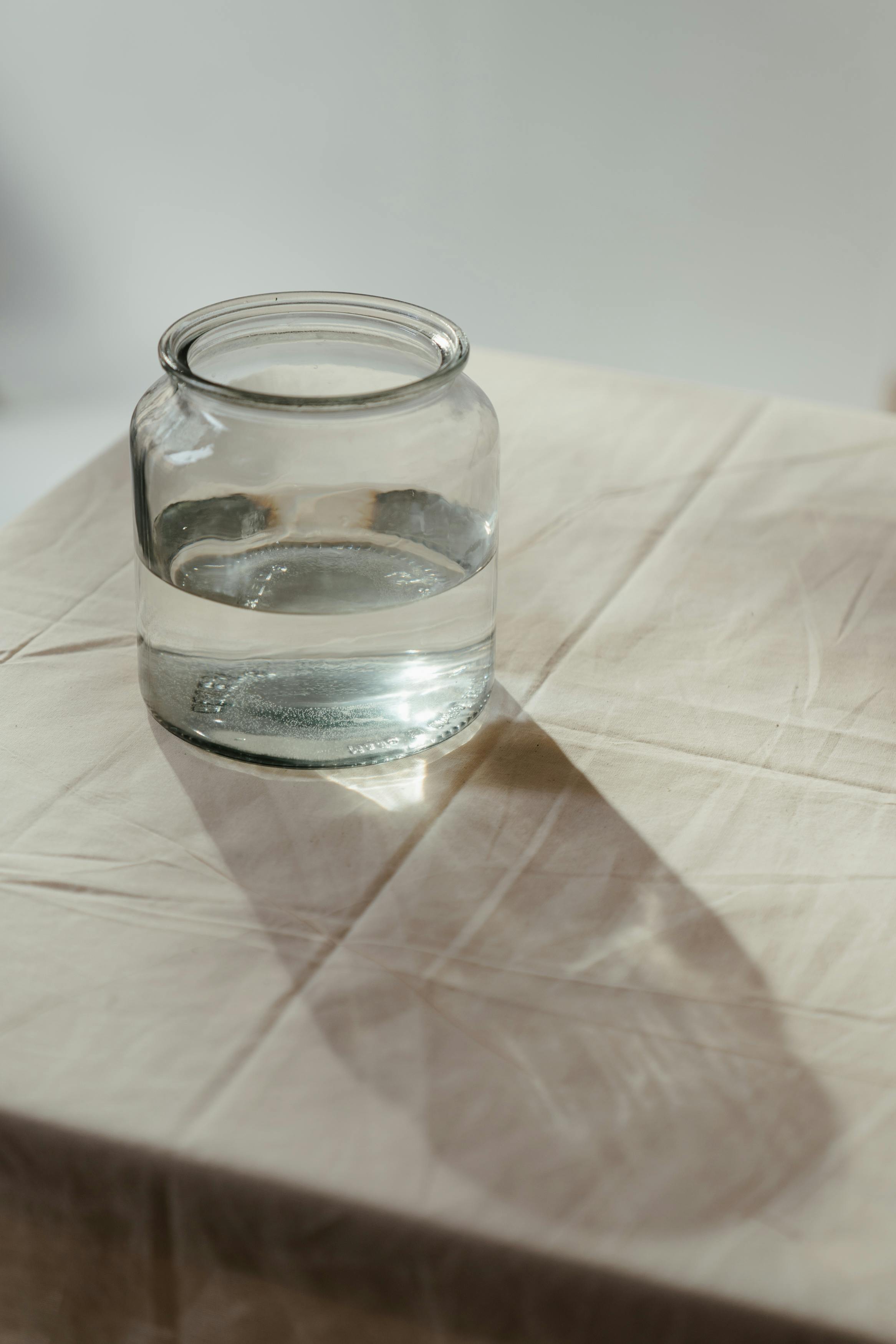 Clear Glass Jar on White Textile · Free Stock Photo