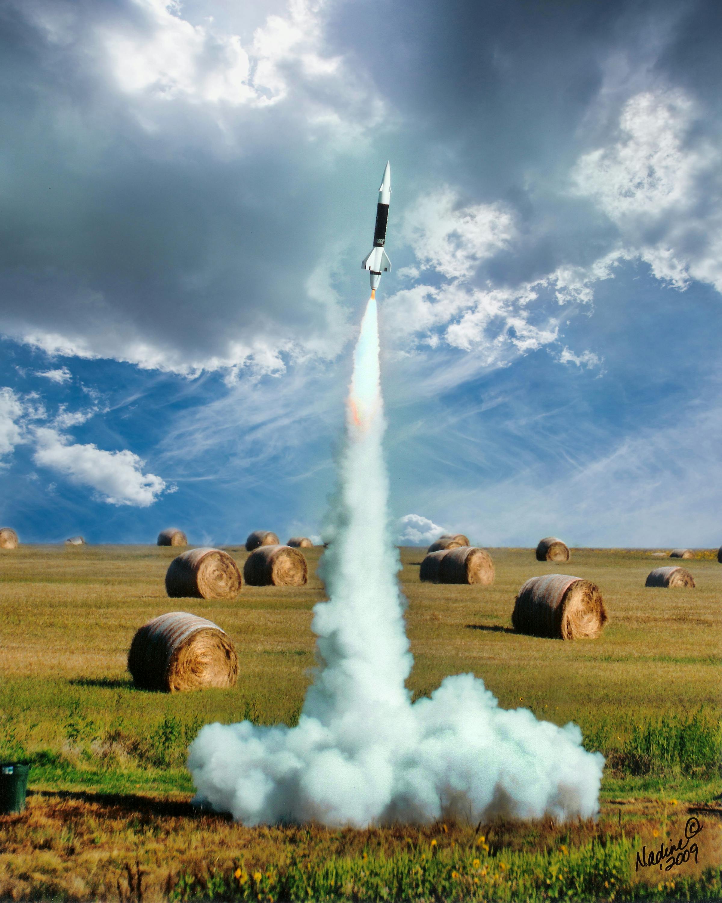 Launched model rocket in rural field · Free Stock Photo