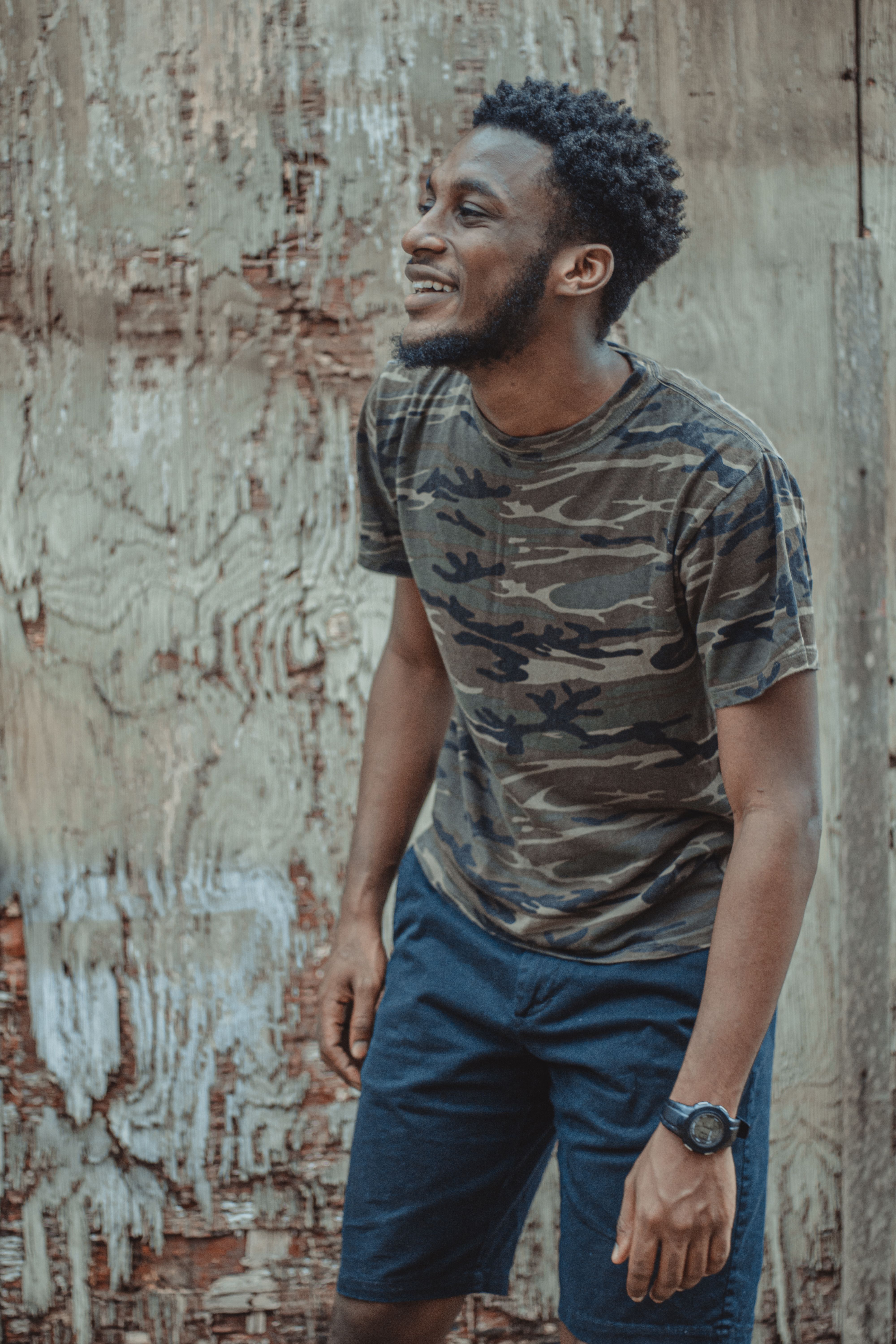 Photo of Man Standing While Smiling · Free Stock Photo