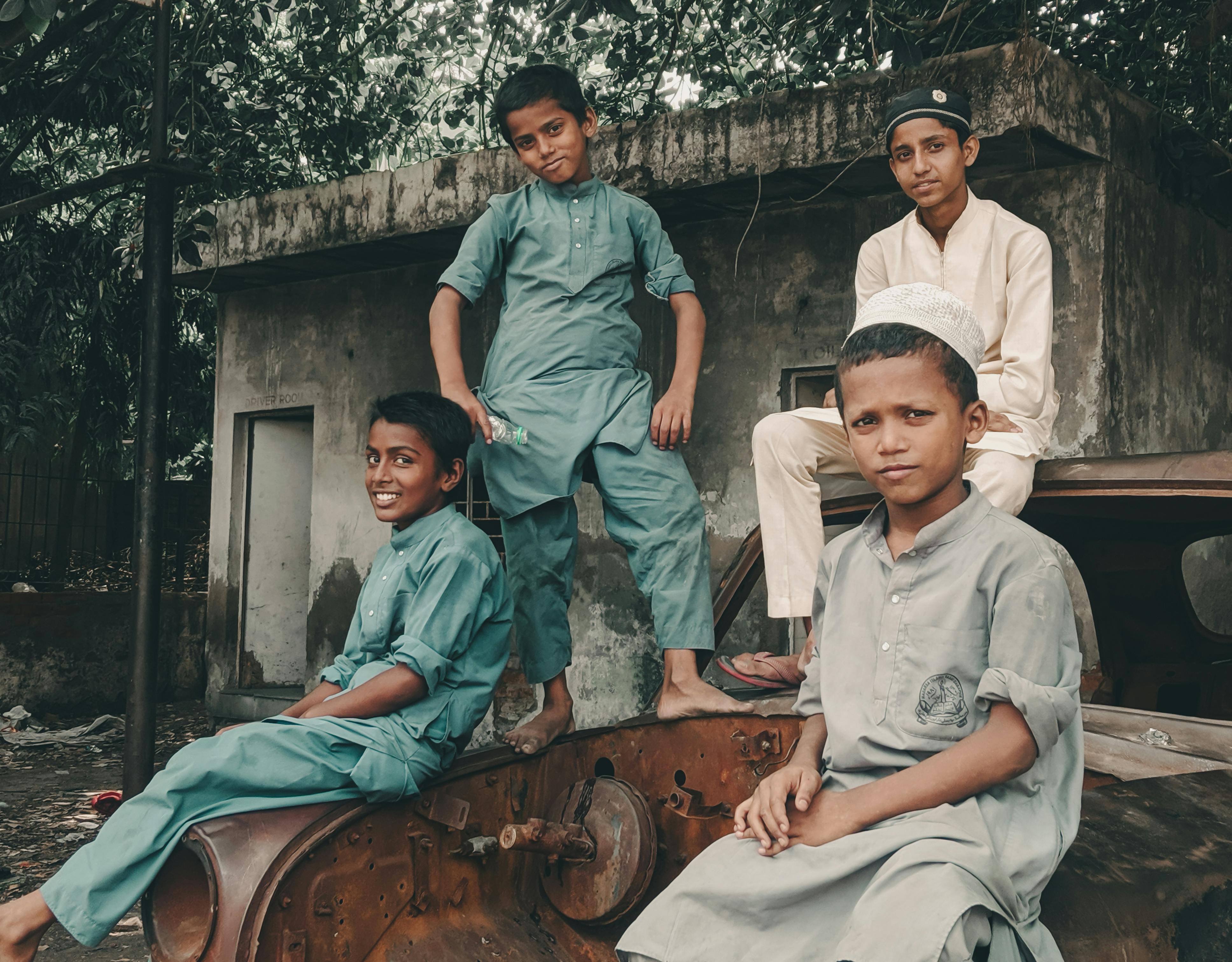 Photo of Boys in Traditional Clothing Posing · Free Stock Photo
