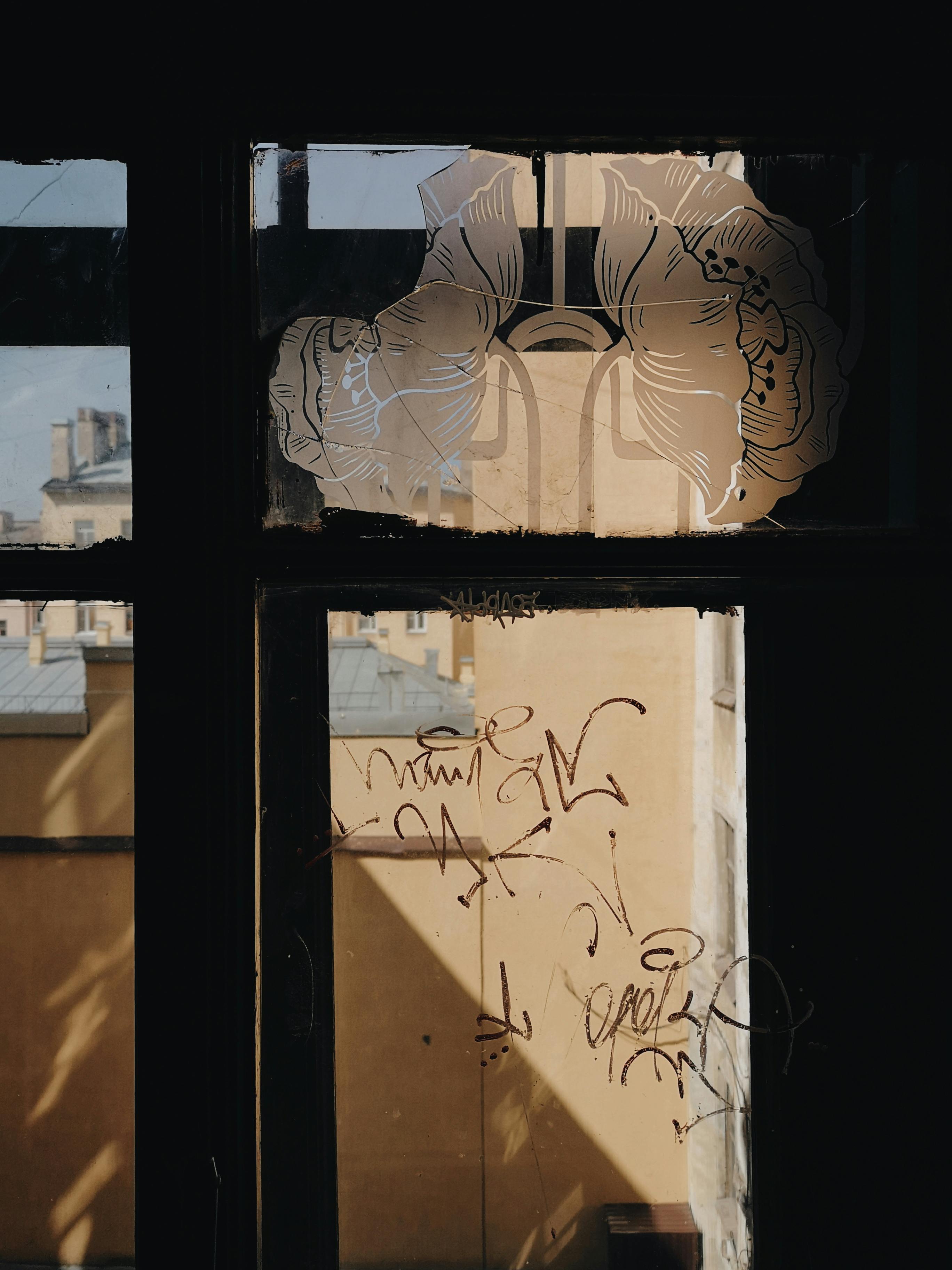 Glass Window with Vandal · Free Stock Photo