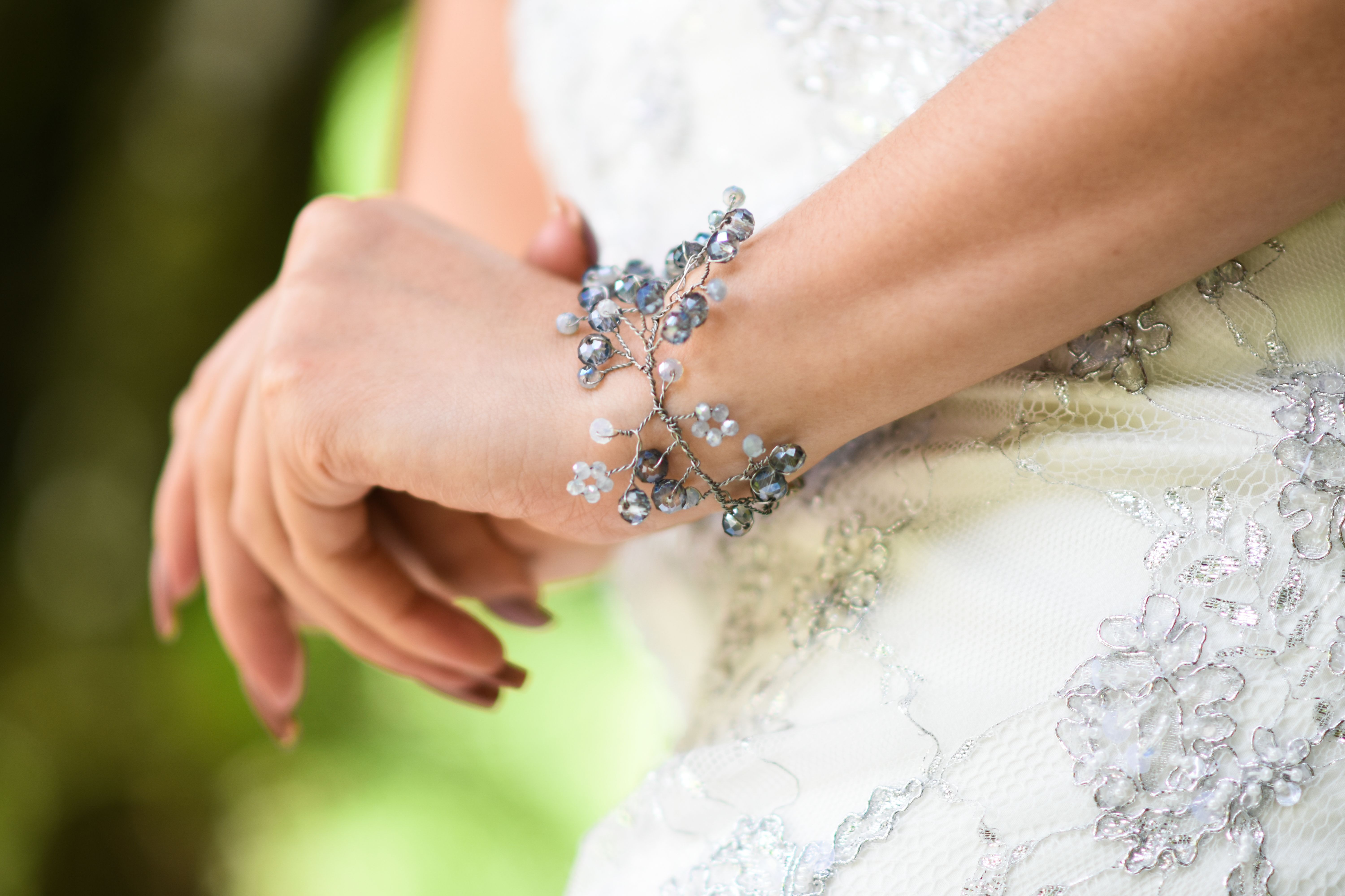 A Hand Holding a Cup and Wearing Jewellery · Free Stock Photo