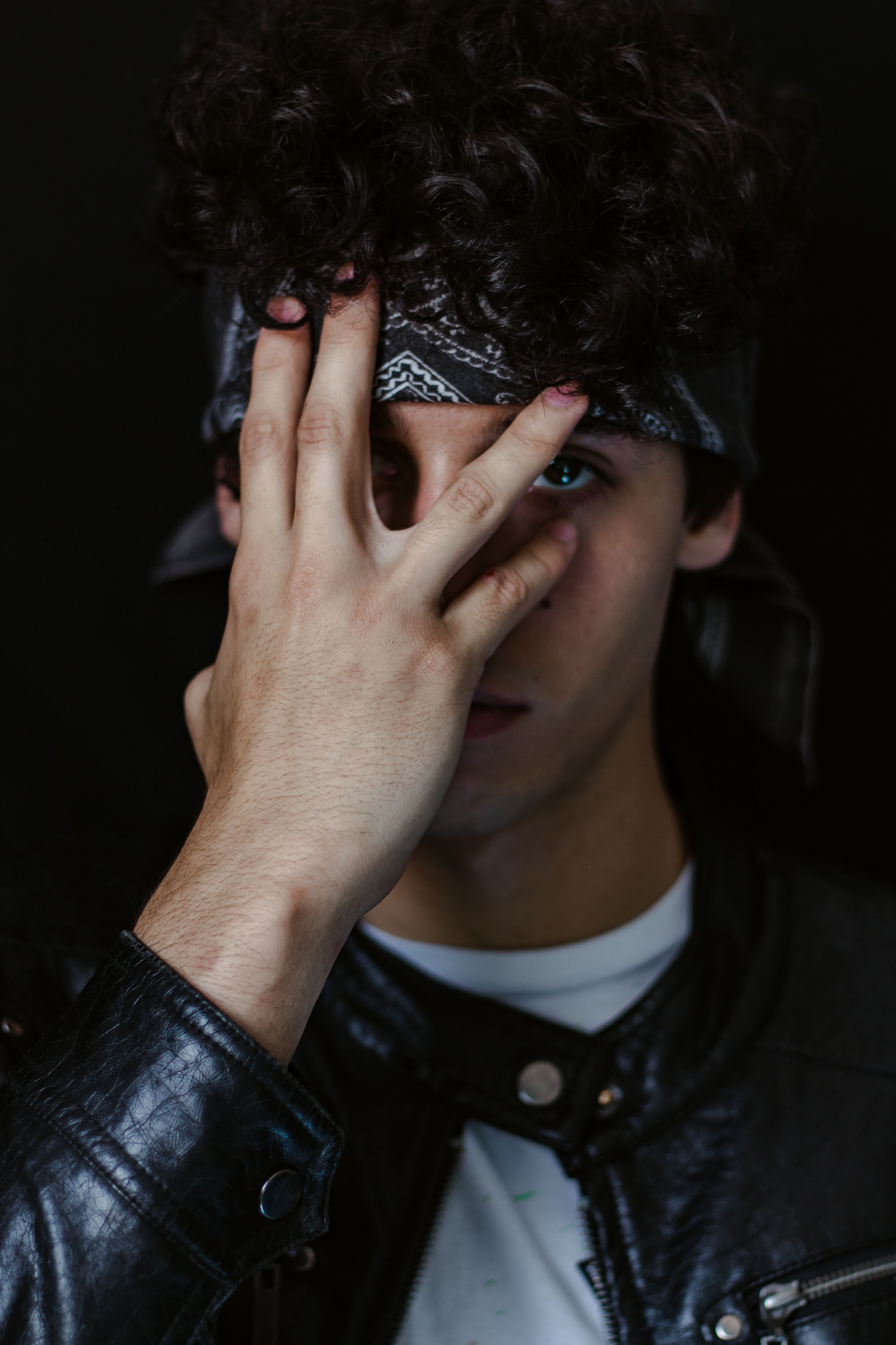 A Man Covering His Face with His Hand · Free Stock Photo