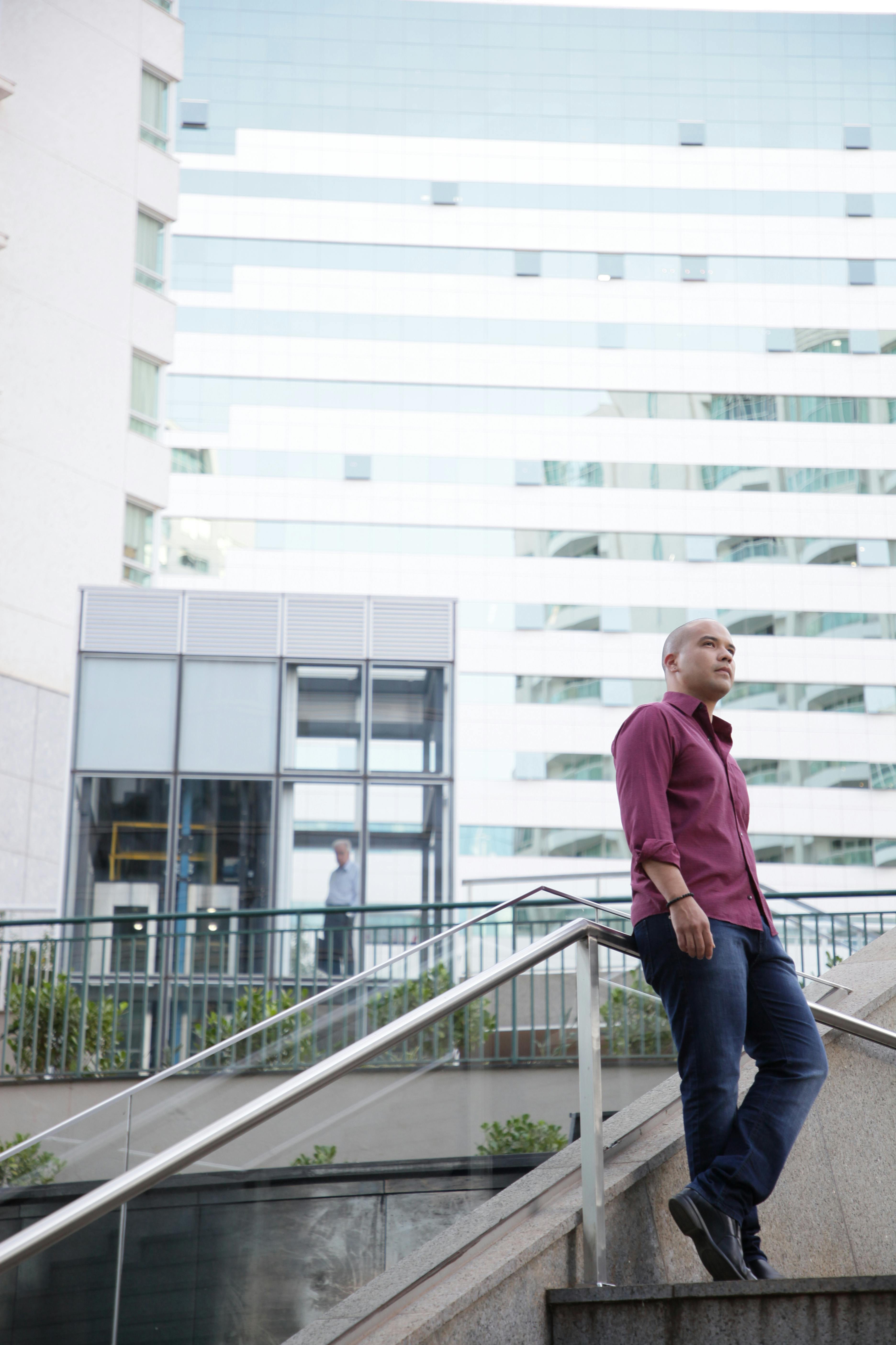 A Man in Maroon Long Sleeve Shirt · Free Stock Photo